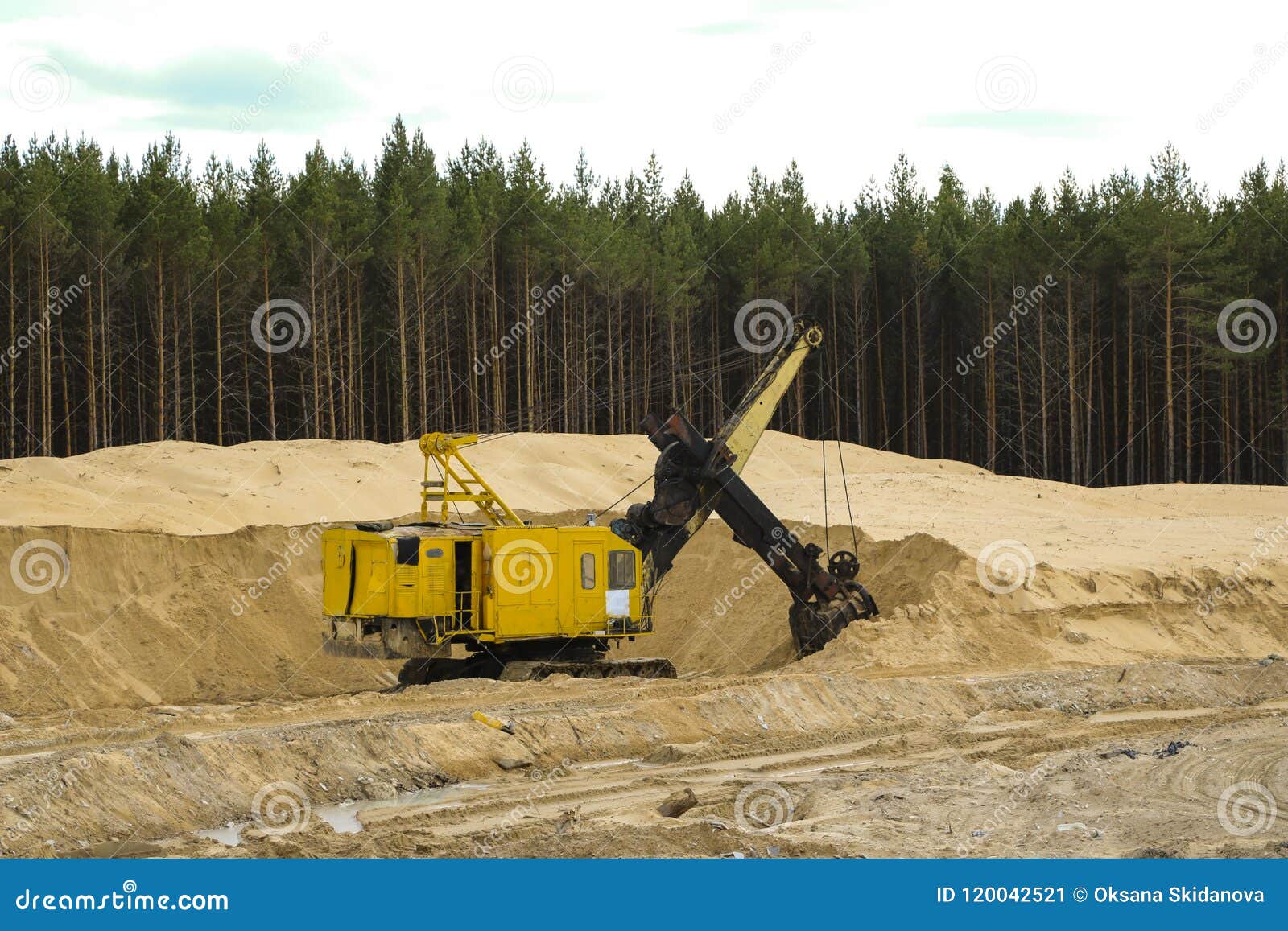 Excavators at a Sand Quarry. Big Orange Digger in Open Sand Mine is ...