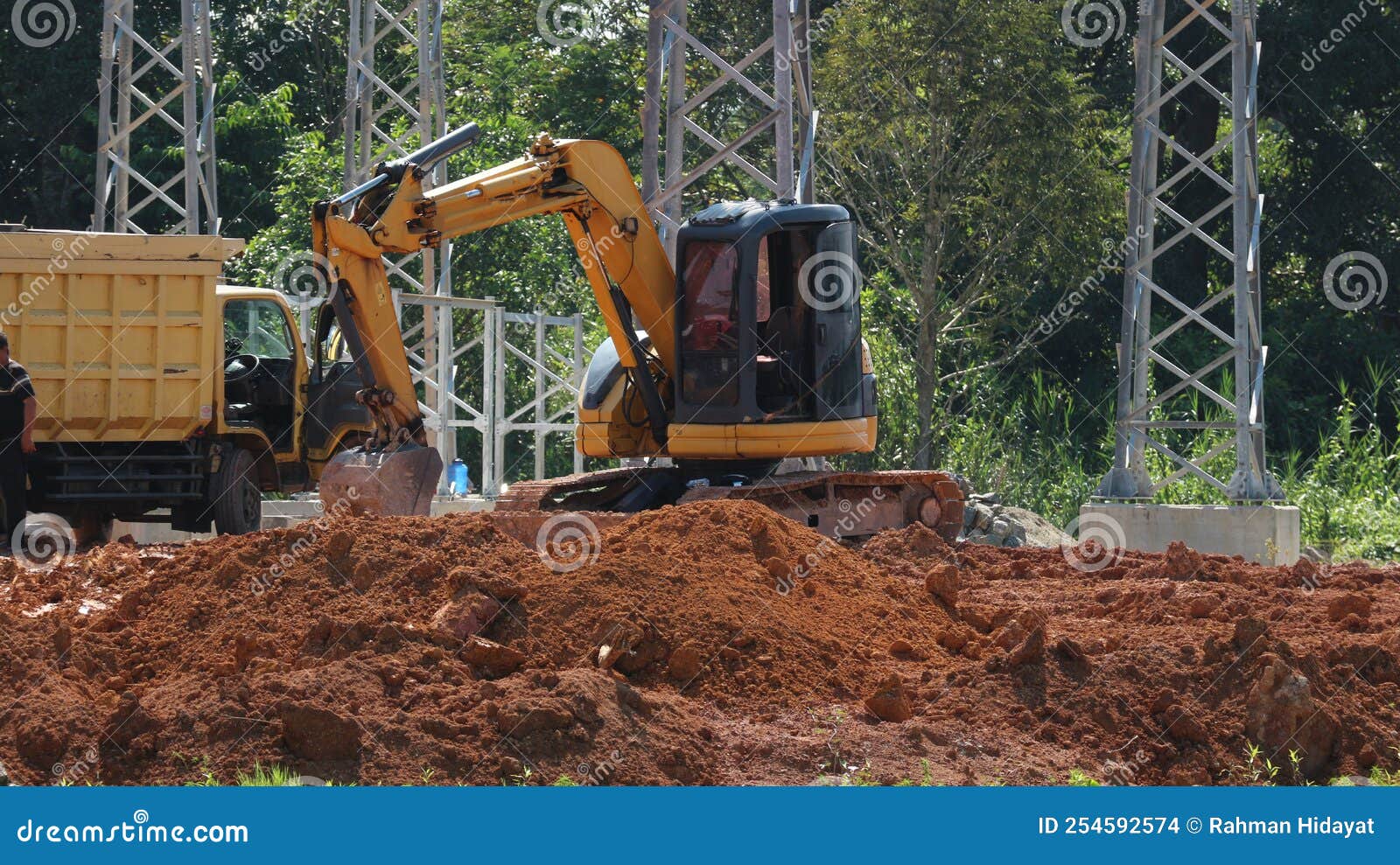 Excavators and Trucks Working Digging the Ground in a Construction ...