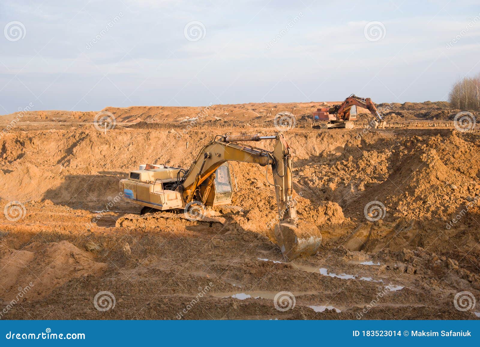 Excavators Working at Open-pit Mining. Backhoe during Earthworks on ...