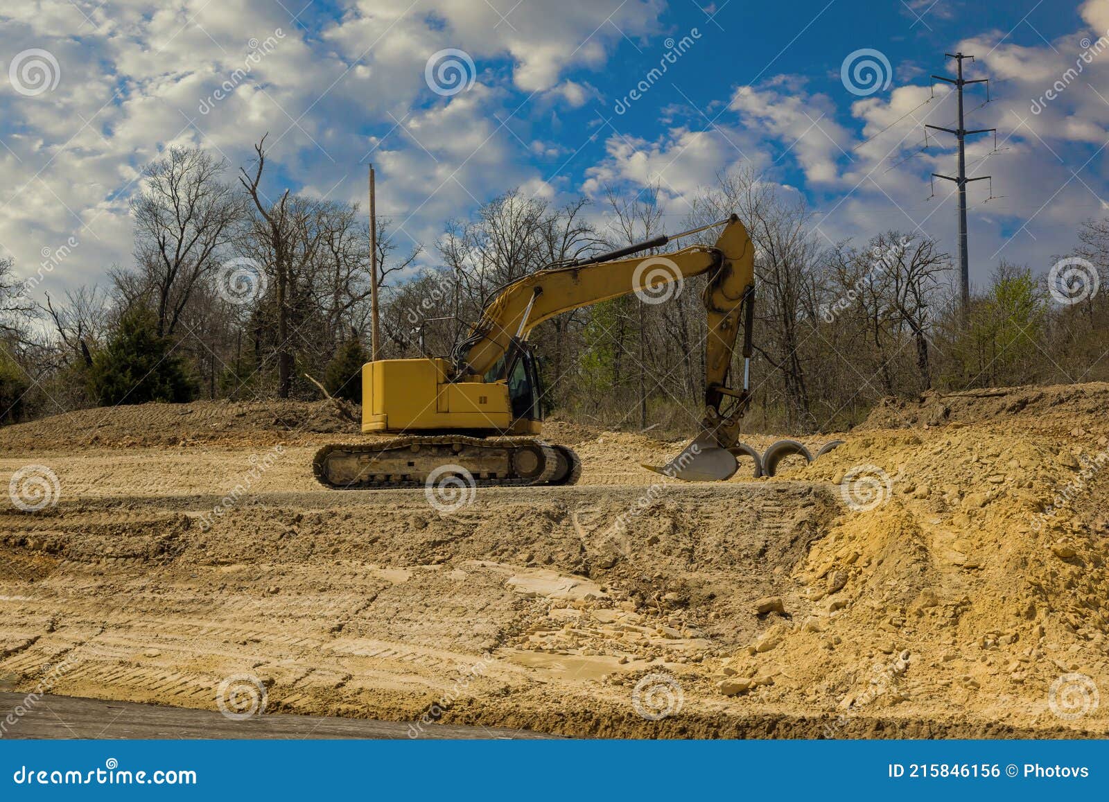 The Excavators in Working on the Under Construction Site of a New Road ...