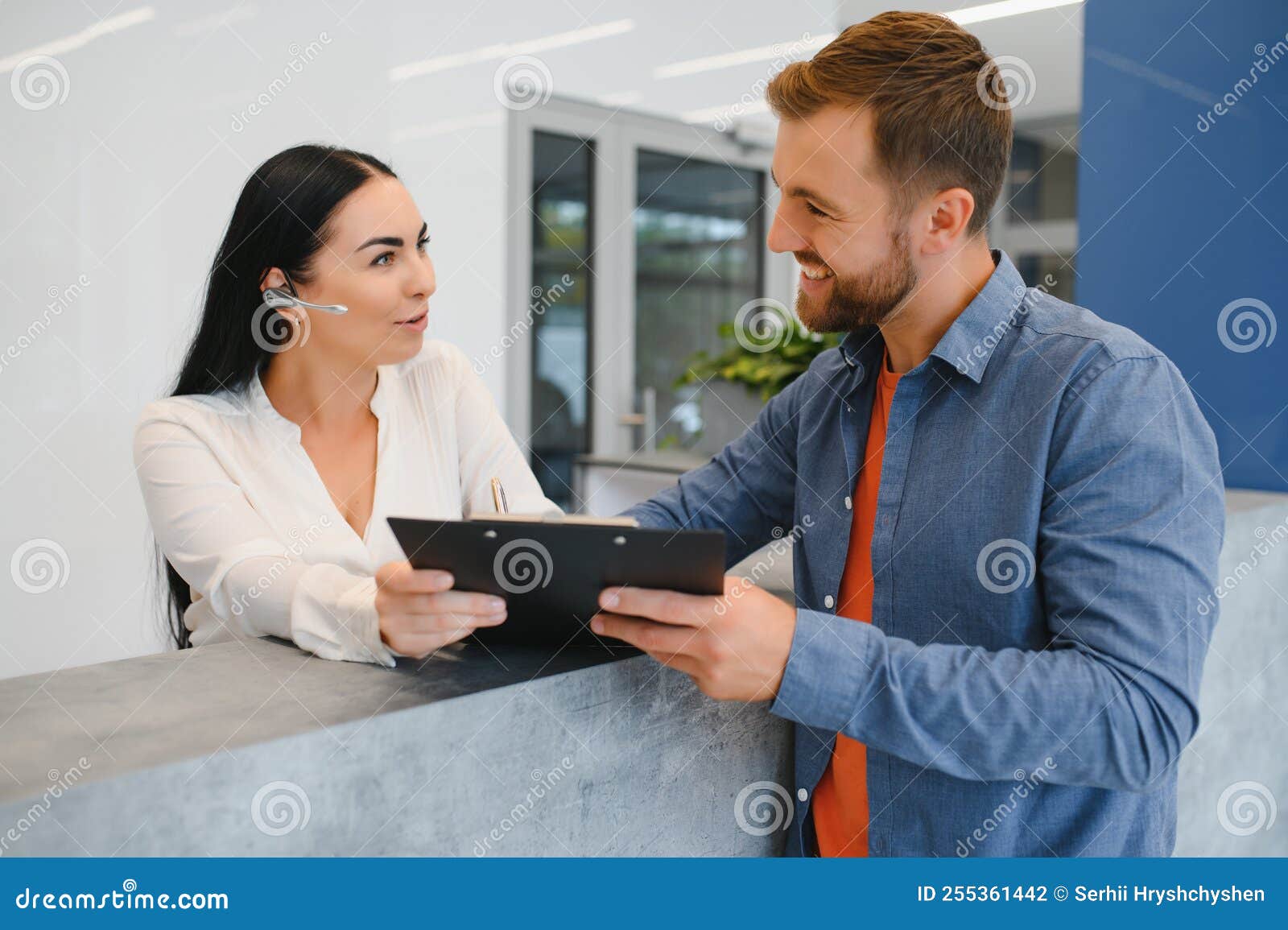 Excellent Service. Nice Friendly Woman Talking To the Client while ...