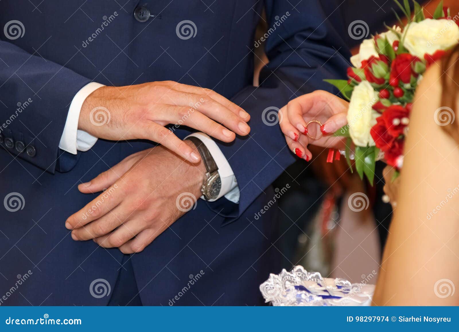 Exchange of Wedding Rings. Bride Places the Ring on the Groom`s Hand ...