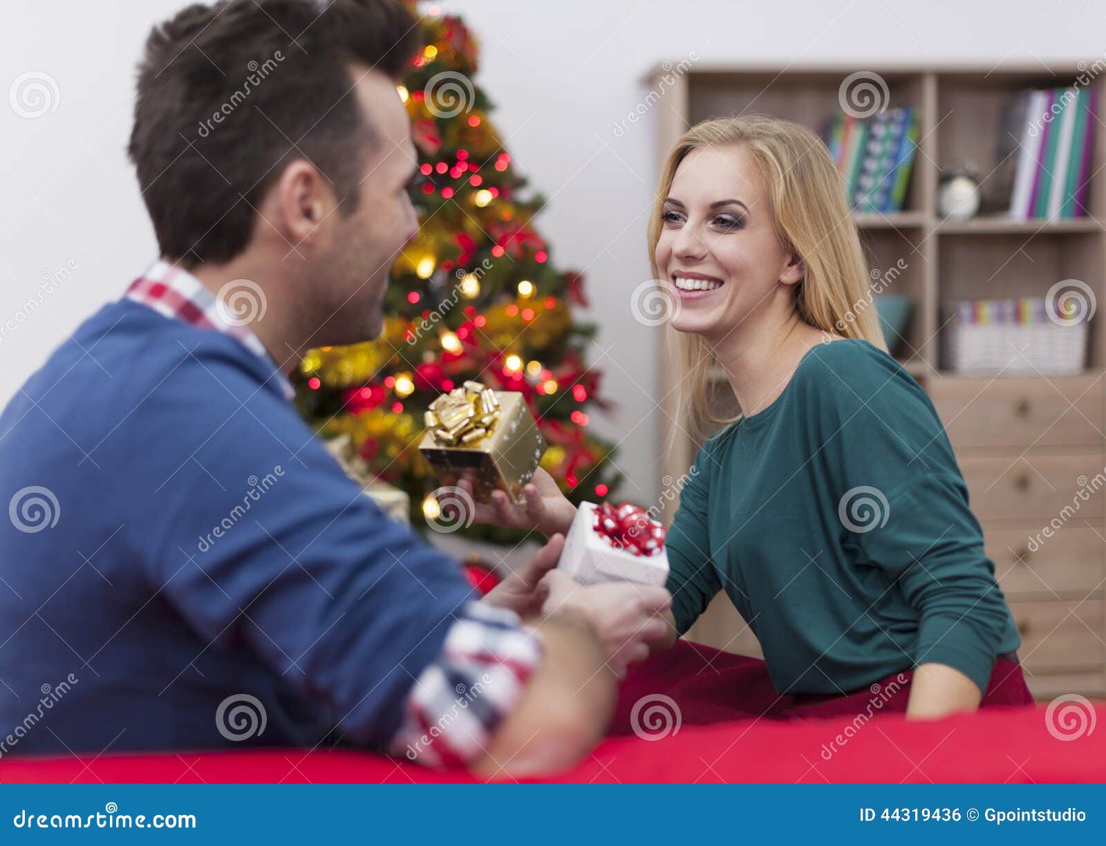 Exchanging Christmas gift stock photo. Image of ornament - 44319436