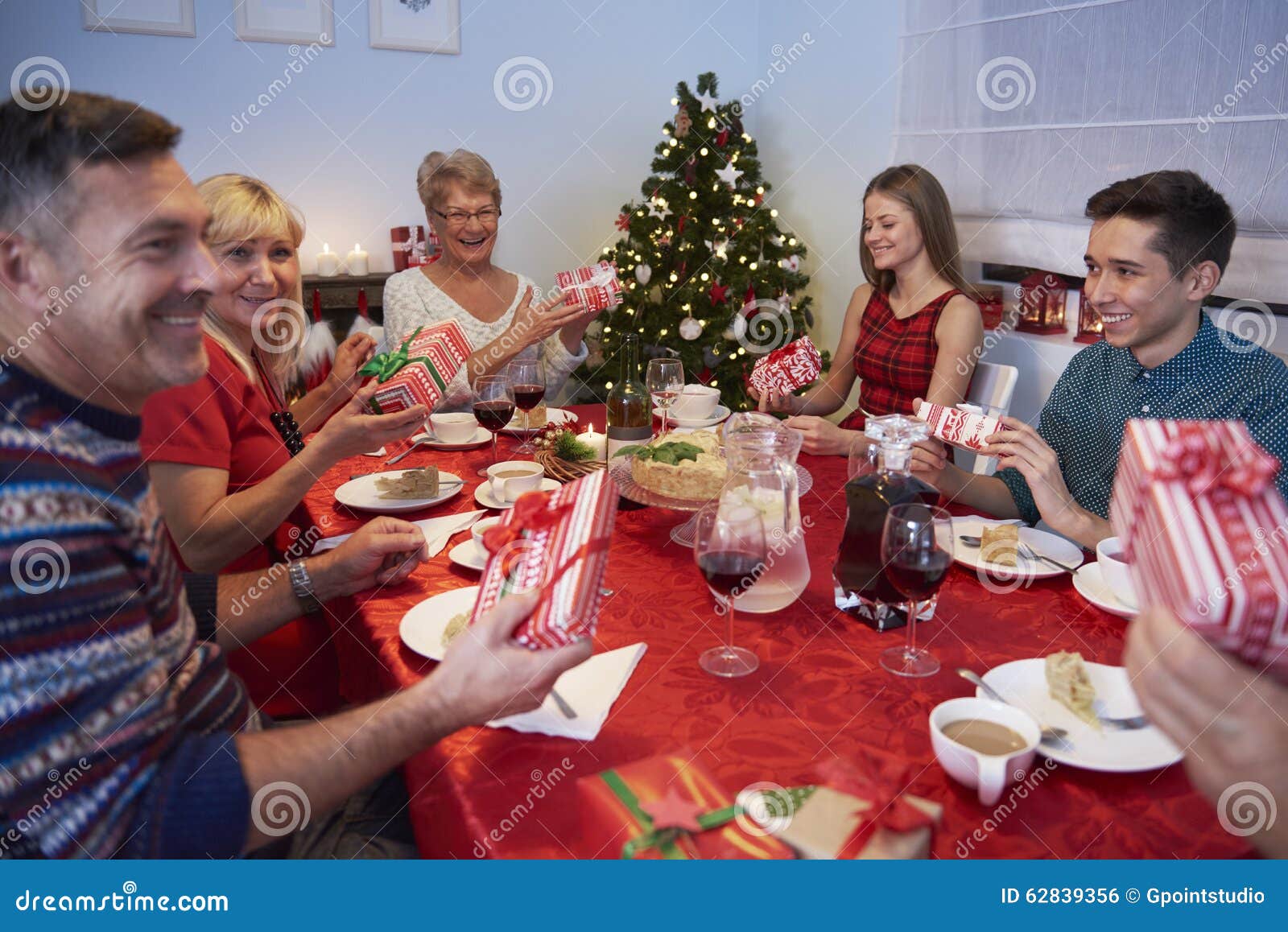 Exchanging christmas gifts stock photo. Image of giving - 62839356