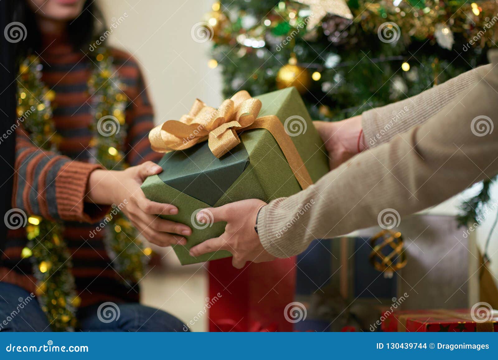 Exchanging Christmas Present Stock Photo - Image of female, surprise ...
