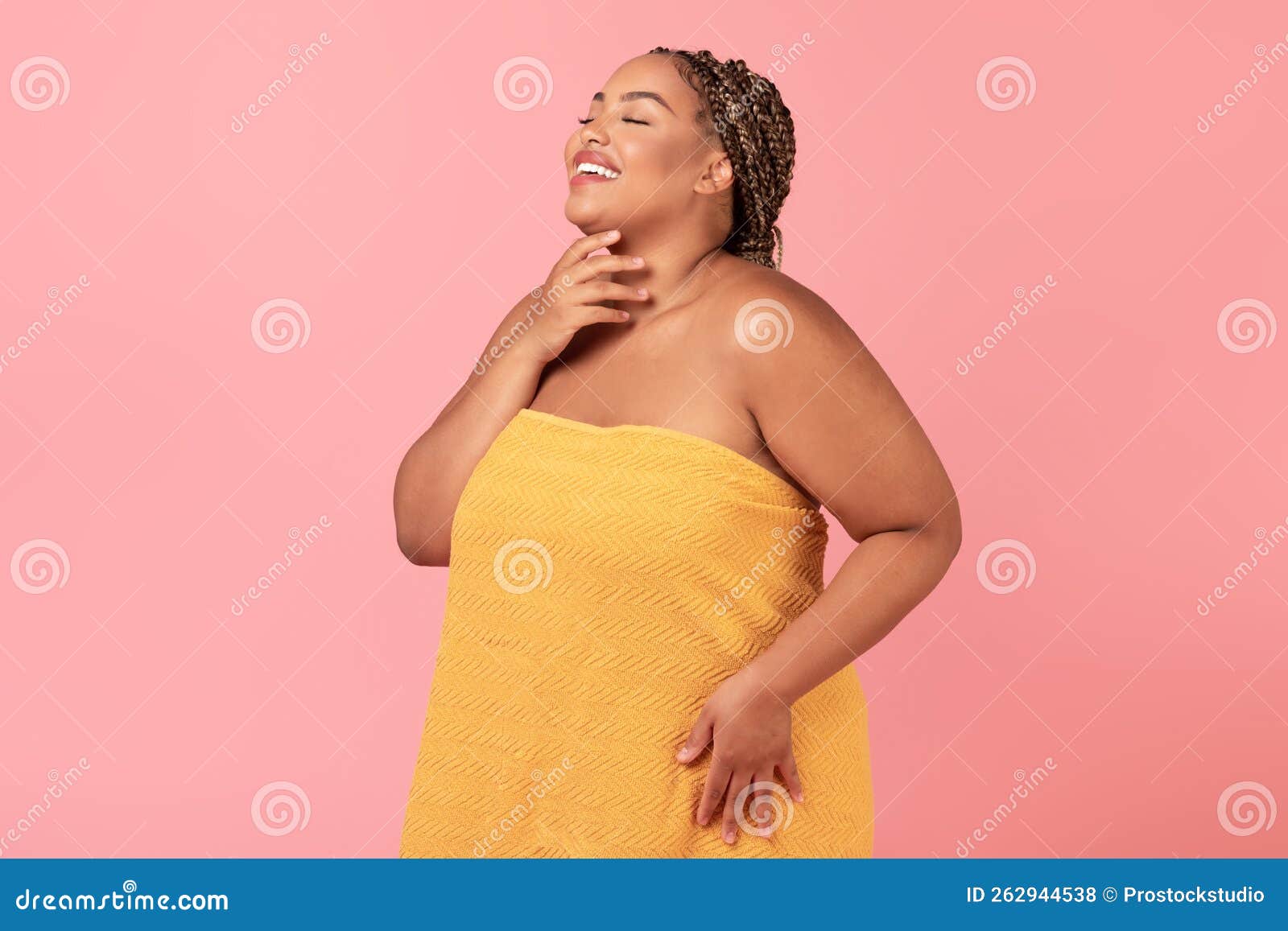 Excited African American Body Positive Lady Wrapped In Towel Touching