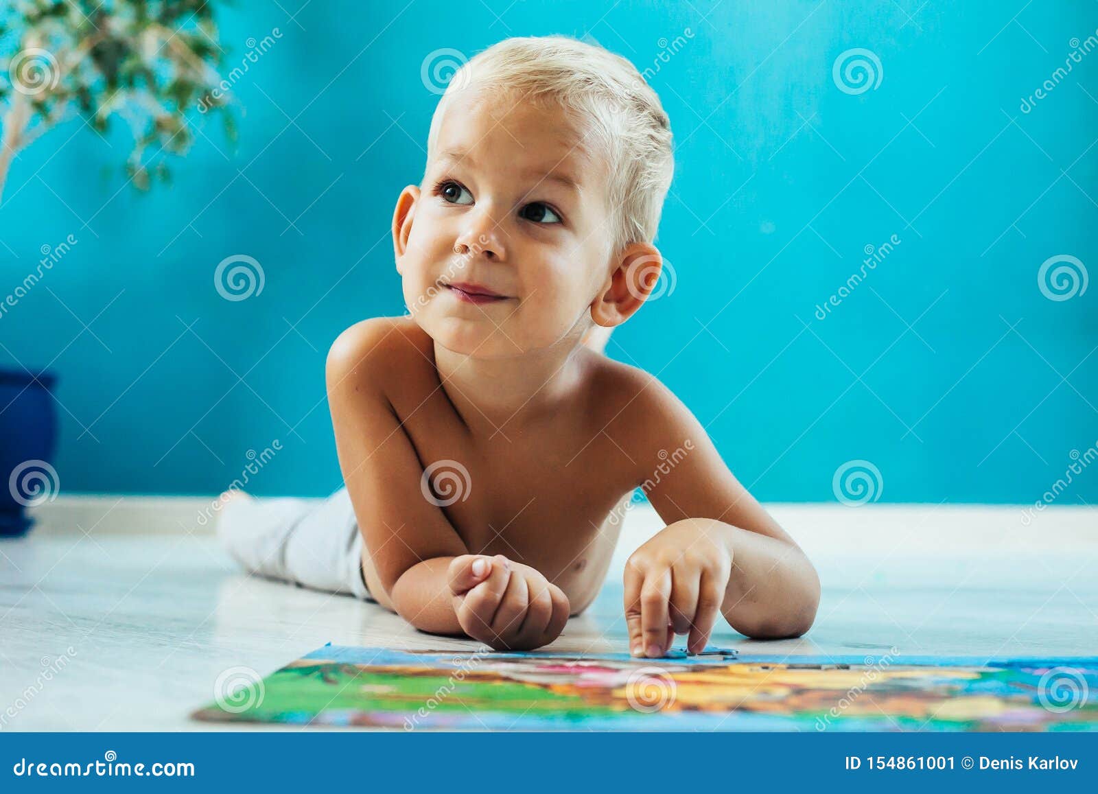 Boy Learning How To Solve a Puzzle Stock Image - Image of blond ...