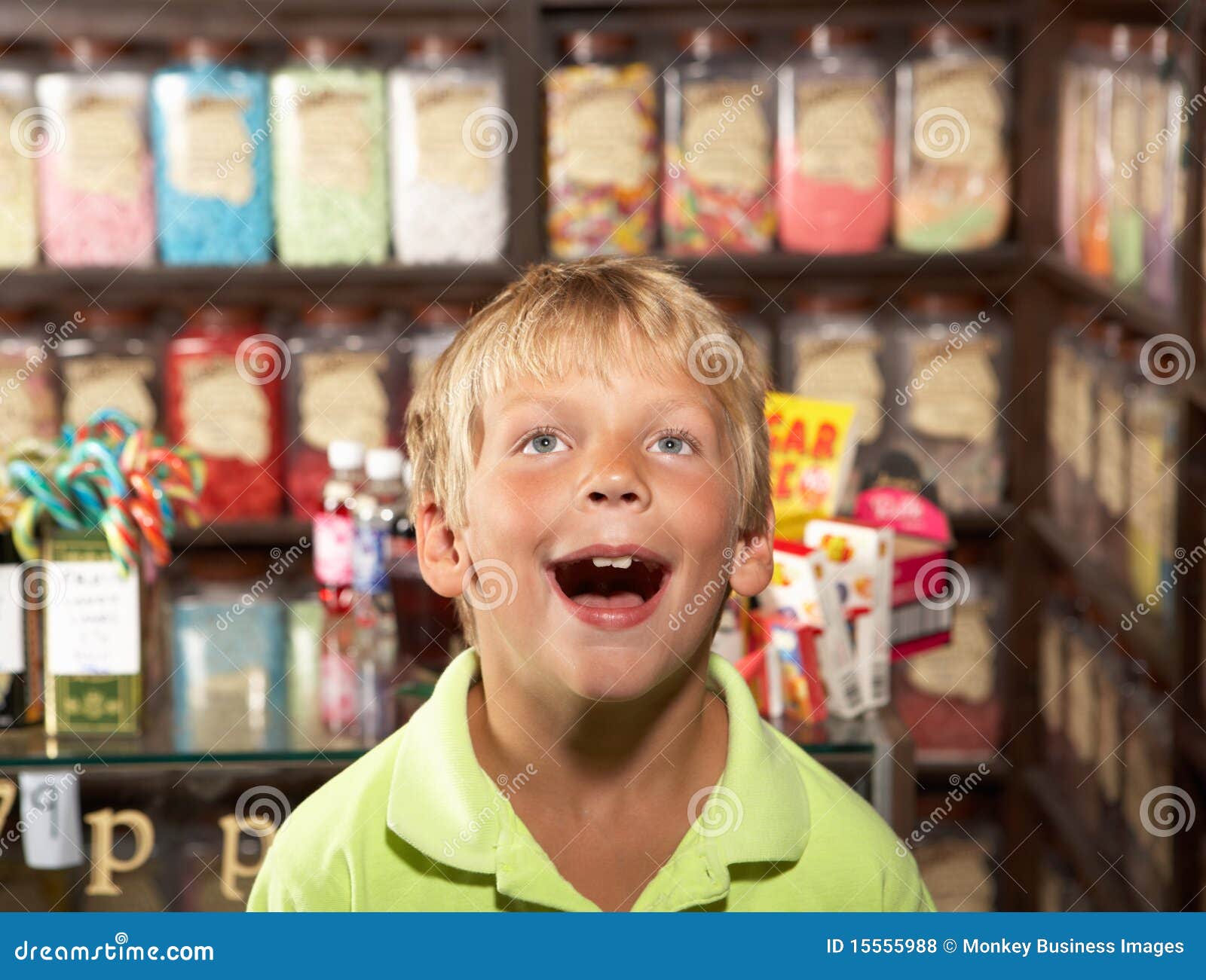 Excited Boy Standing in Sweet Shop Stock Photo - Image of confectionery ...