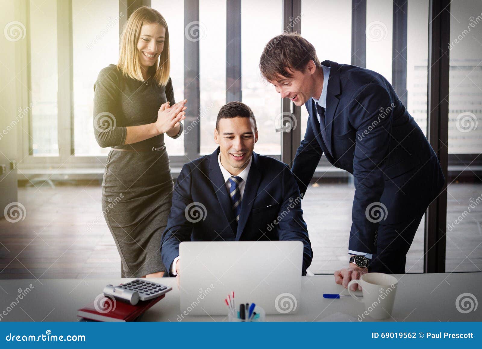 Excited Business People in Modern Office Working on Project Stock Photo ...