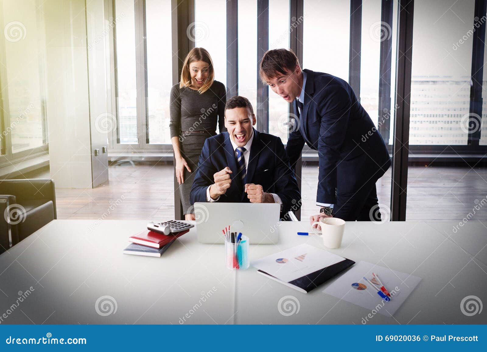 Excited Business People in Modern Office Working on Project Stock Photo ...
