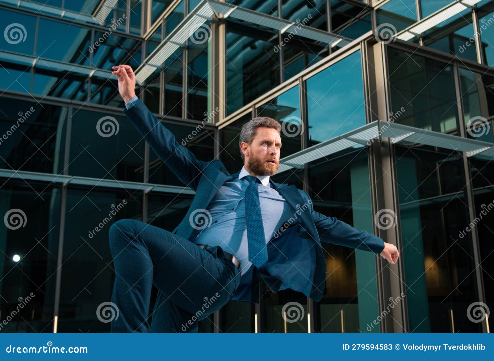Excited Businessman Jumping Outdoors on Office Building. Stock Image ...