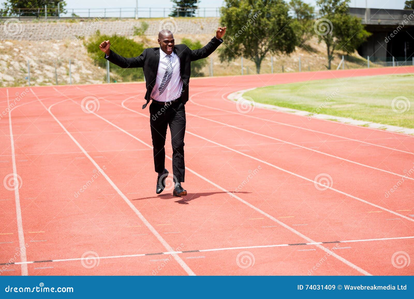 Excited Businessman Standing on the Running Track Stock Image - Image ...