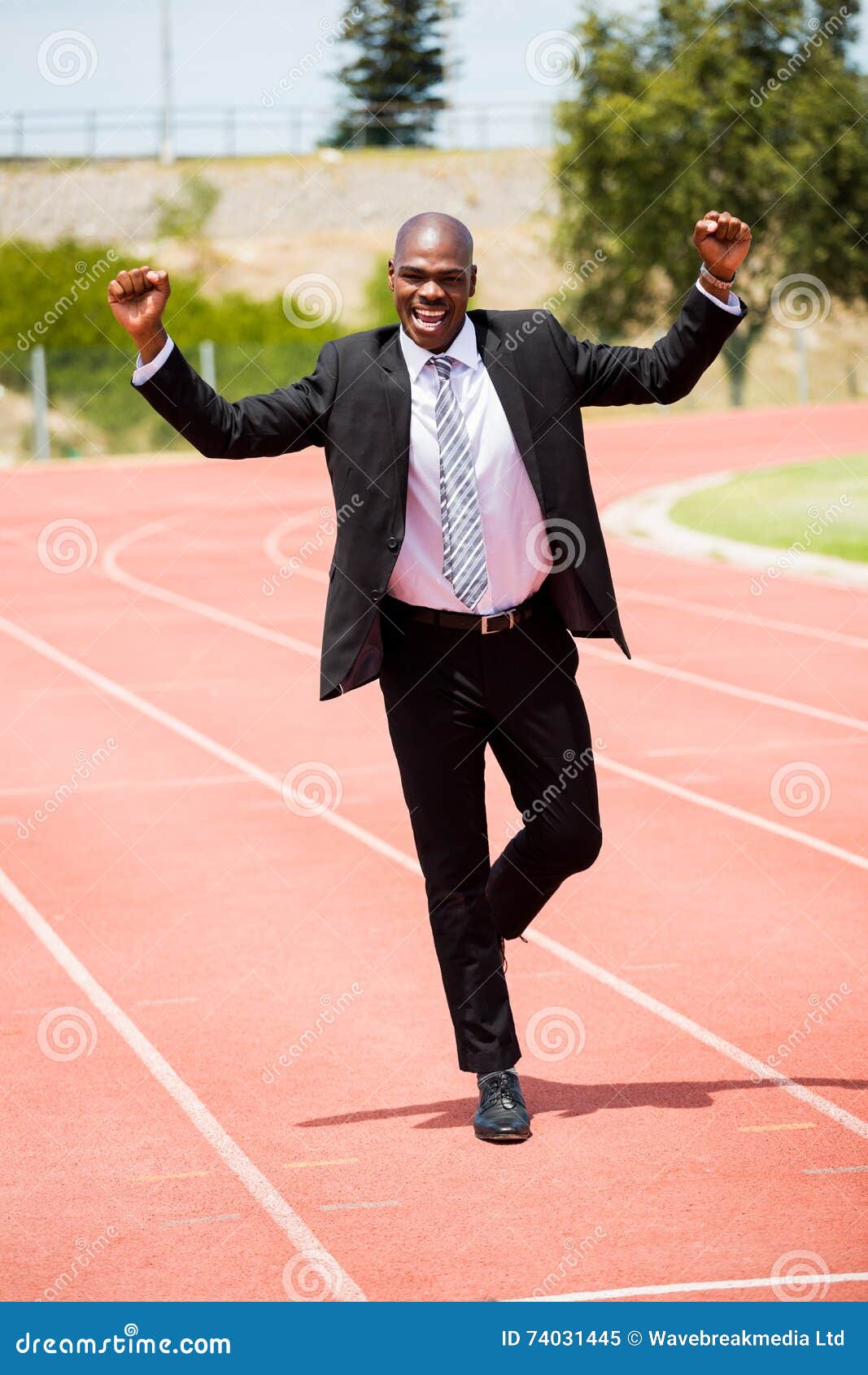 Excited Businessman Standing on the Running Track Stock Image - Image ...