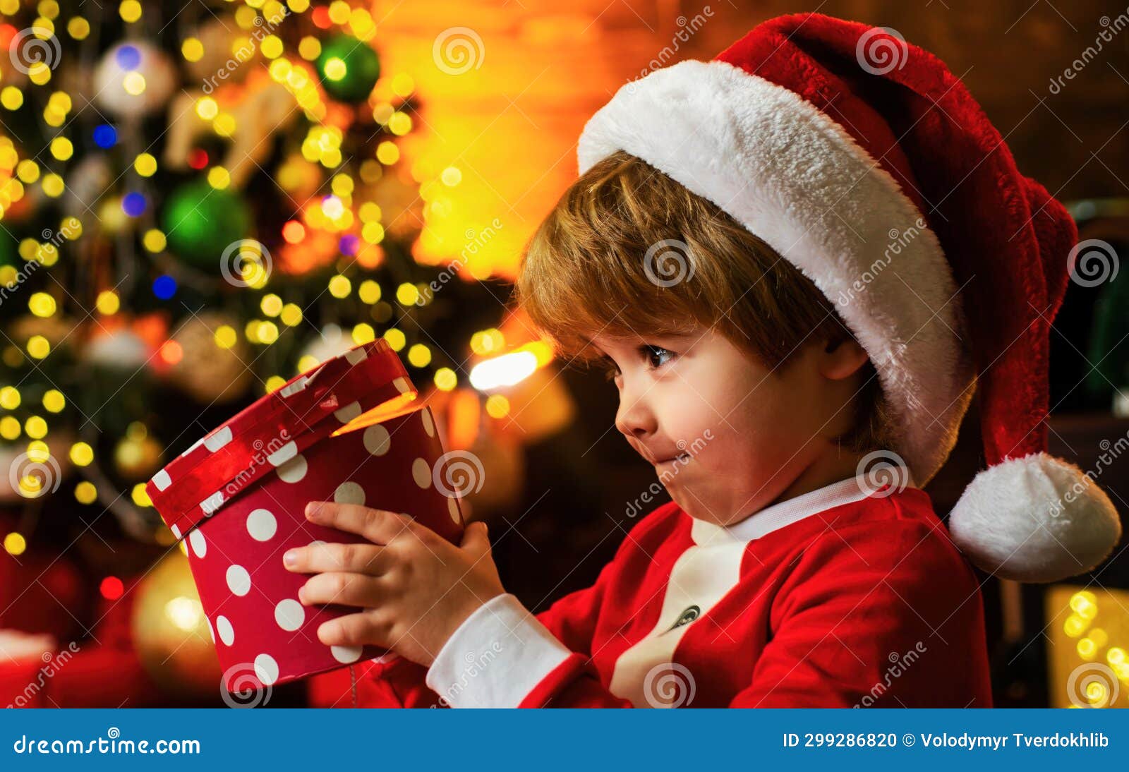 Excited Child Opening a Christmas Gift Present. Stock Photo - Image of ...
