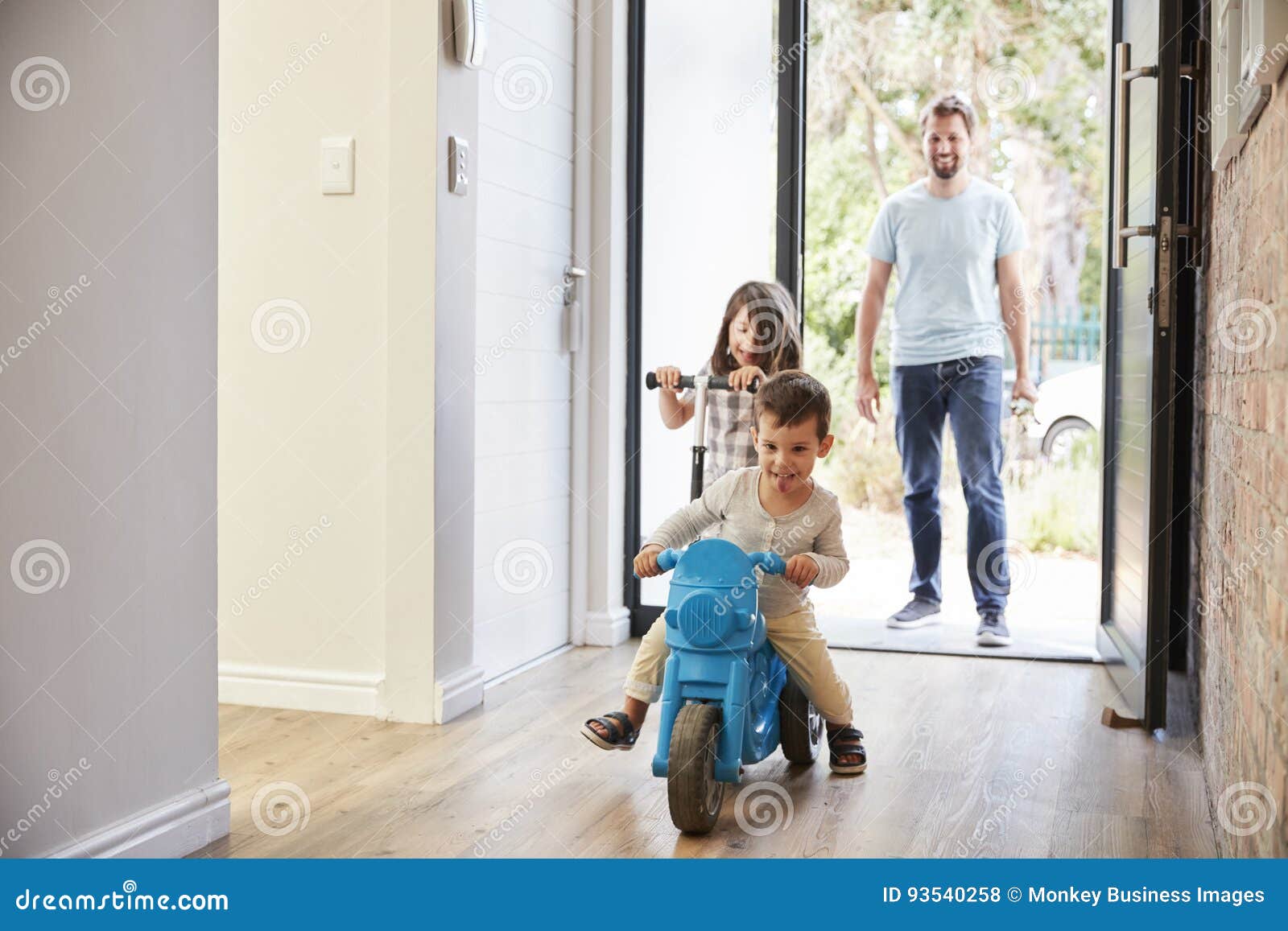 Excited Children Arriving Home with Father Stock Photo - Image of happy ...