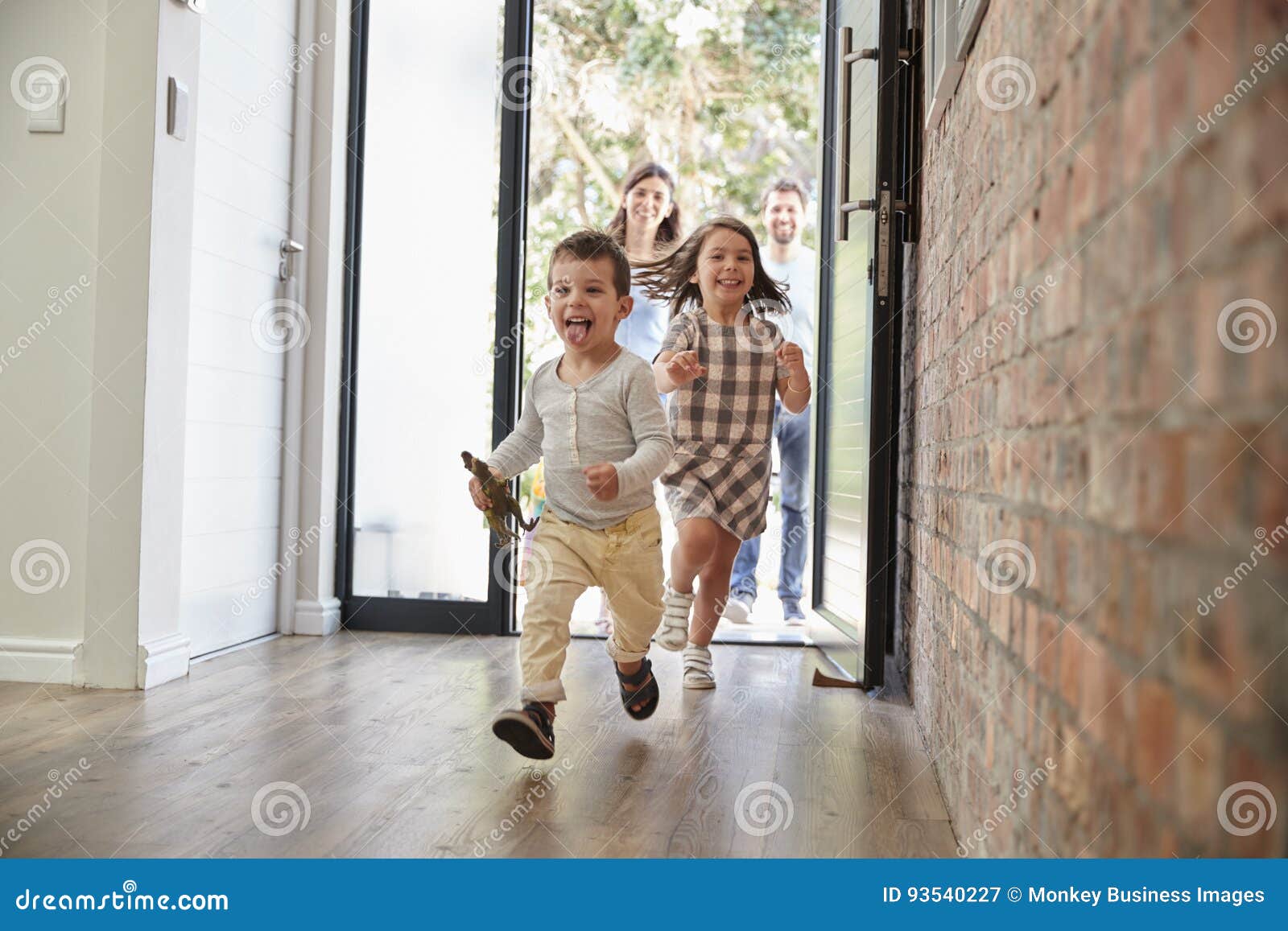 Excited Children Arriving Home with Parents Stock Image - Image of ...