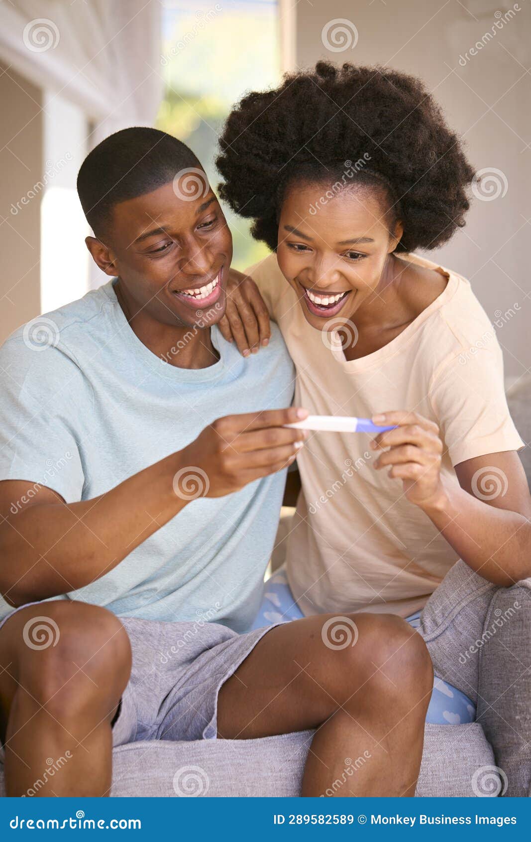 Excited Couple in Bedroom at Home Celebrating Positive Pregnancy Test ... Excited Couple in Bedroom at Home Celebrating Positive Pregnancy Test ...
