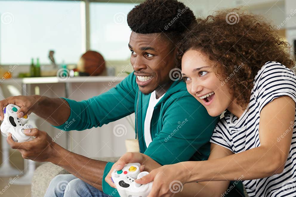 Excited Couple Playing Computer Game in Home Stock Photo - Image of ...