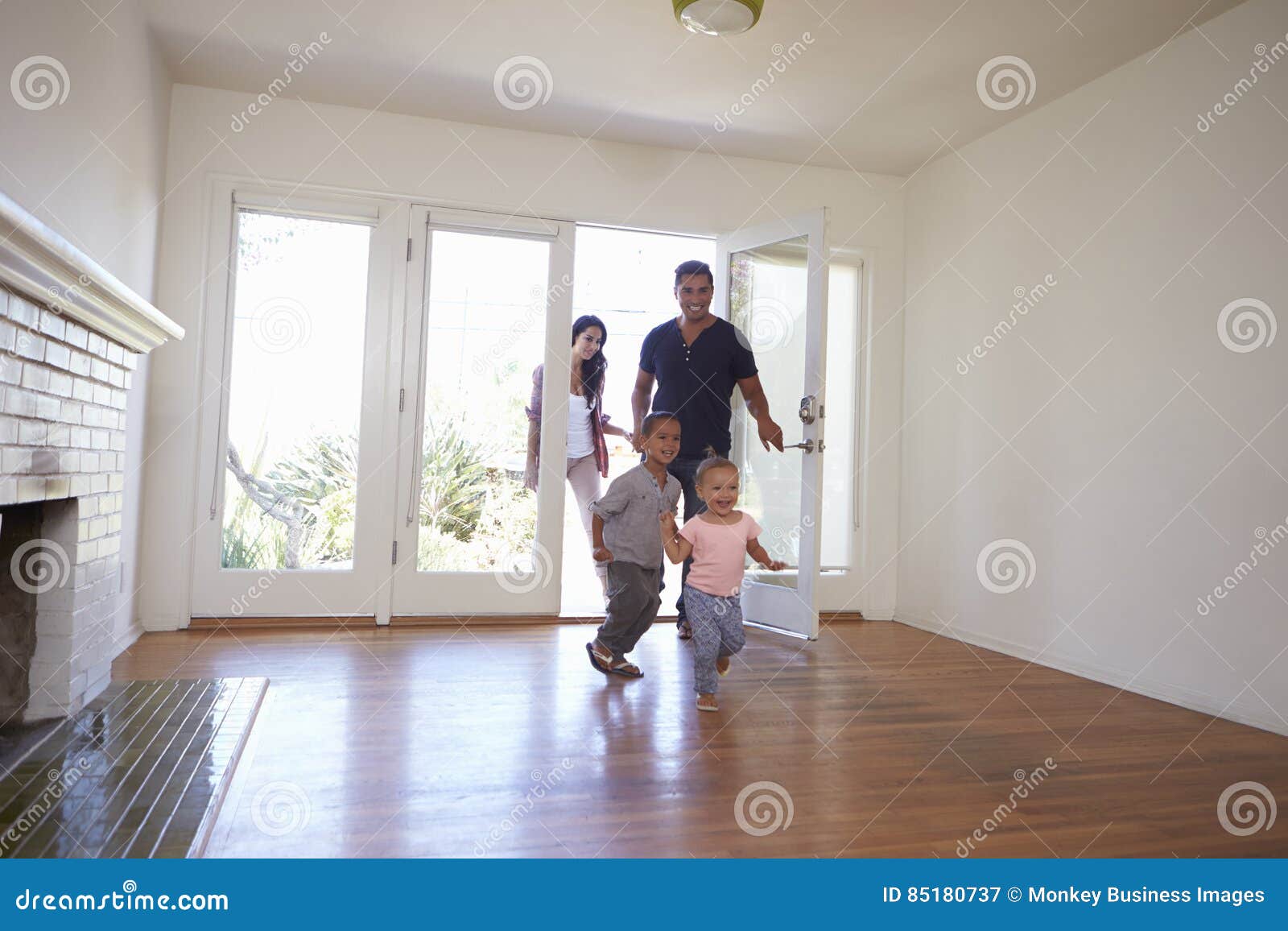 Excited Family Explore New Home on Moving Day Stock Image - Image of ...