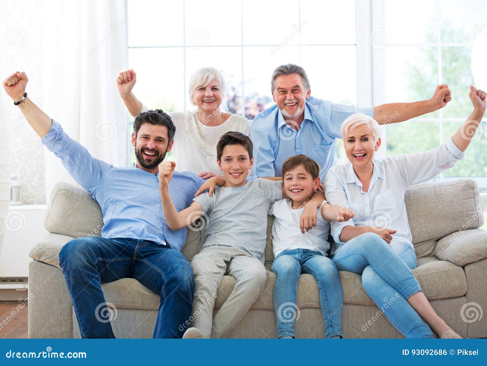 Excited family on sofa stock photo. Image of family, gesturing - 93092686