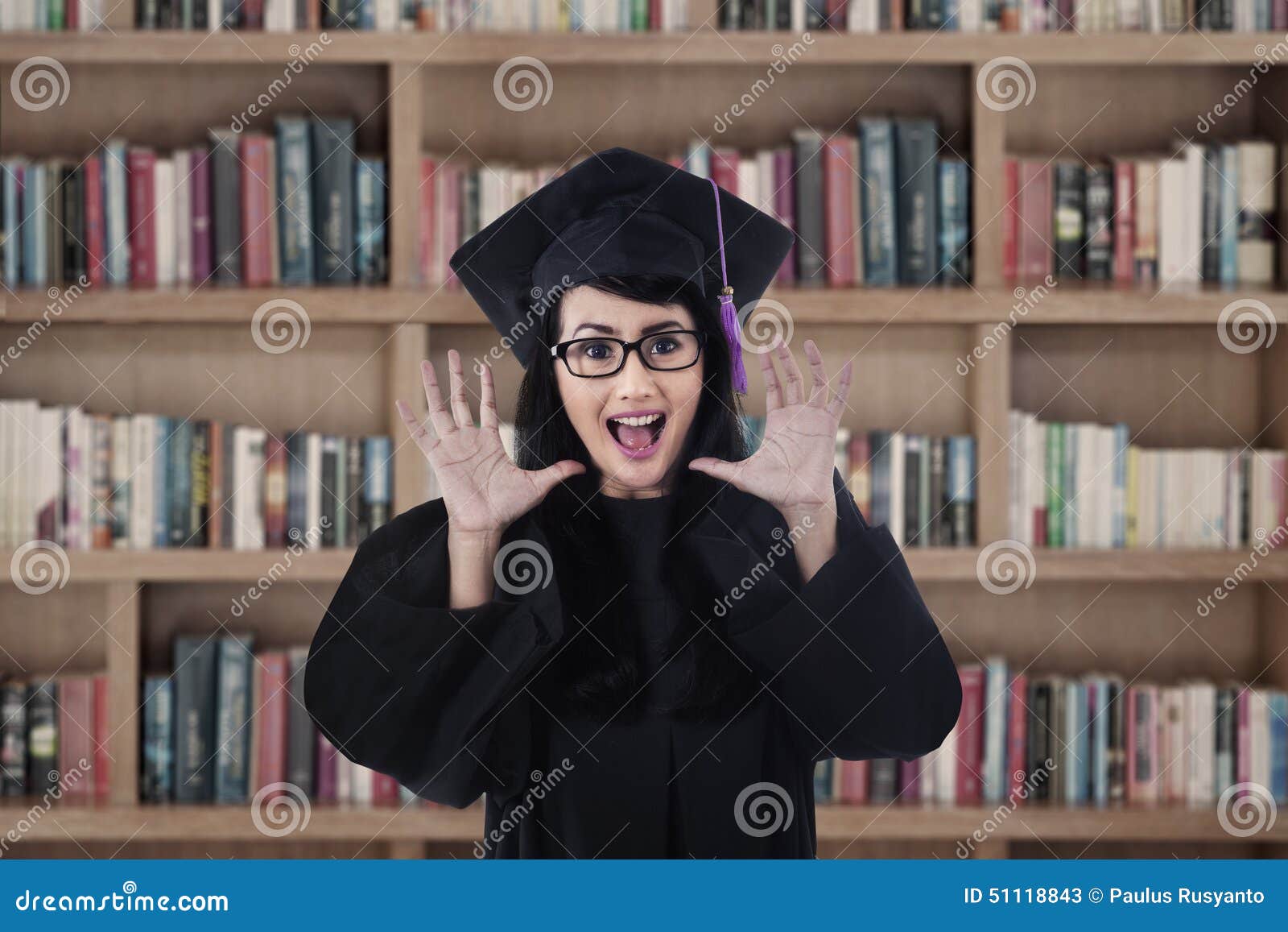 Excited Female Graduate Shouting at Library Stock Image - Image of ...