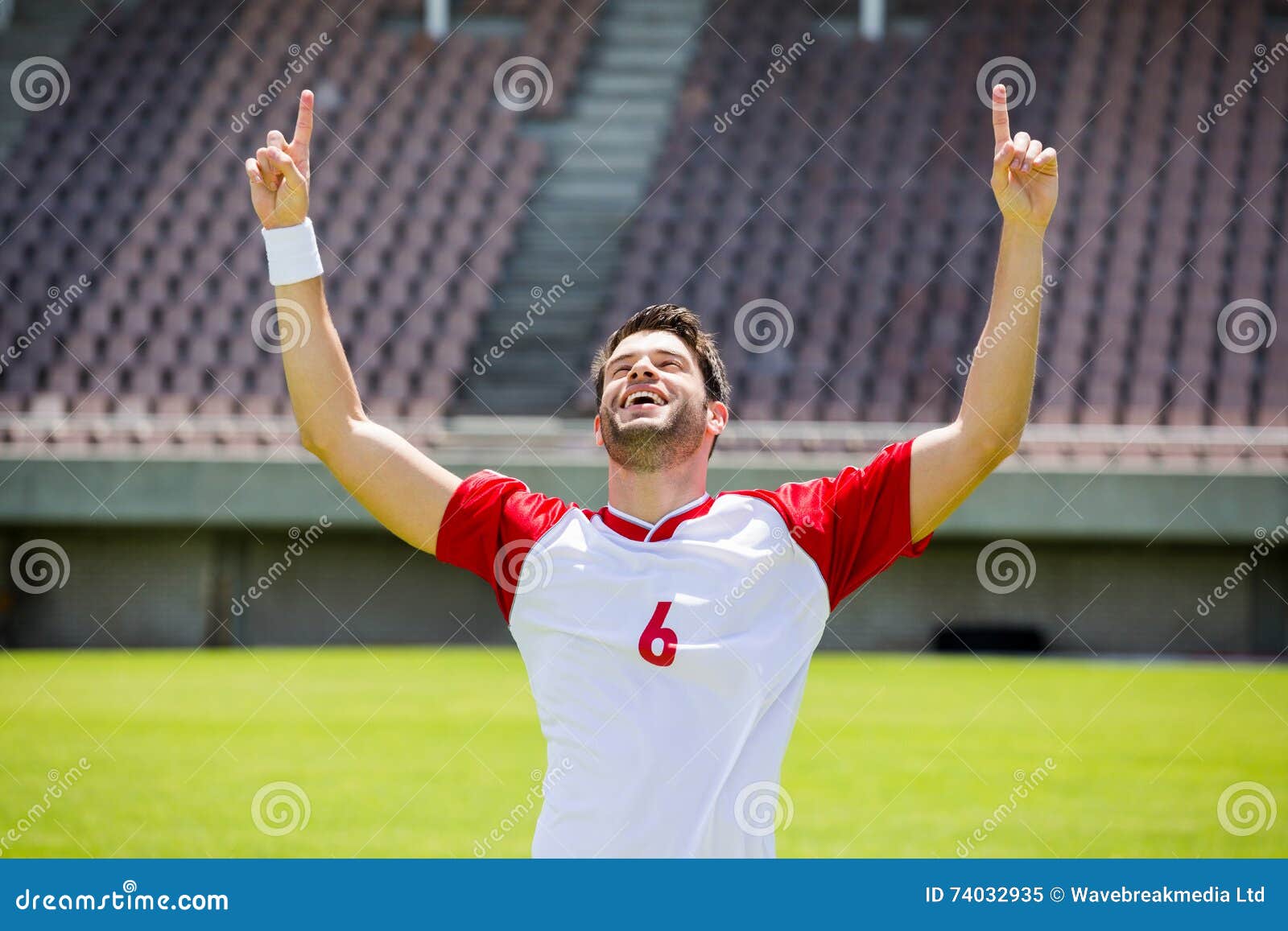 Excited Football Player with Hands Raised Stock Image - Image of ...