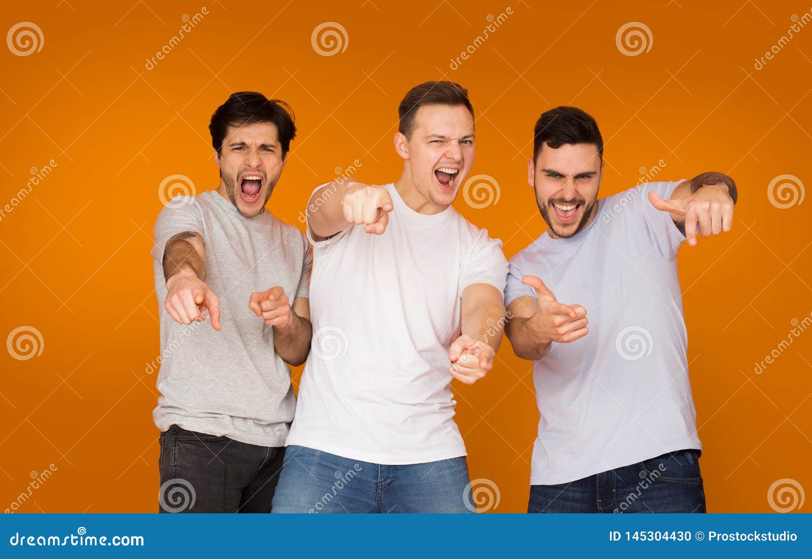 Excited Friends Pointing Fingers at Camera, Orange Background Stock ...