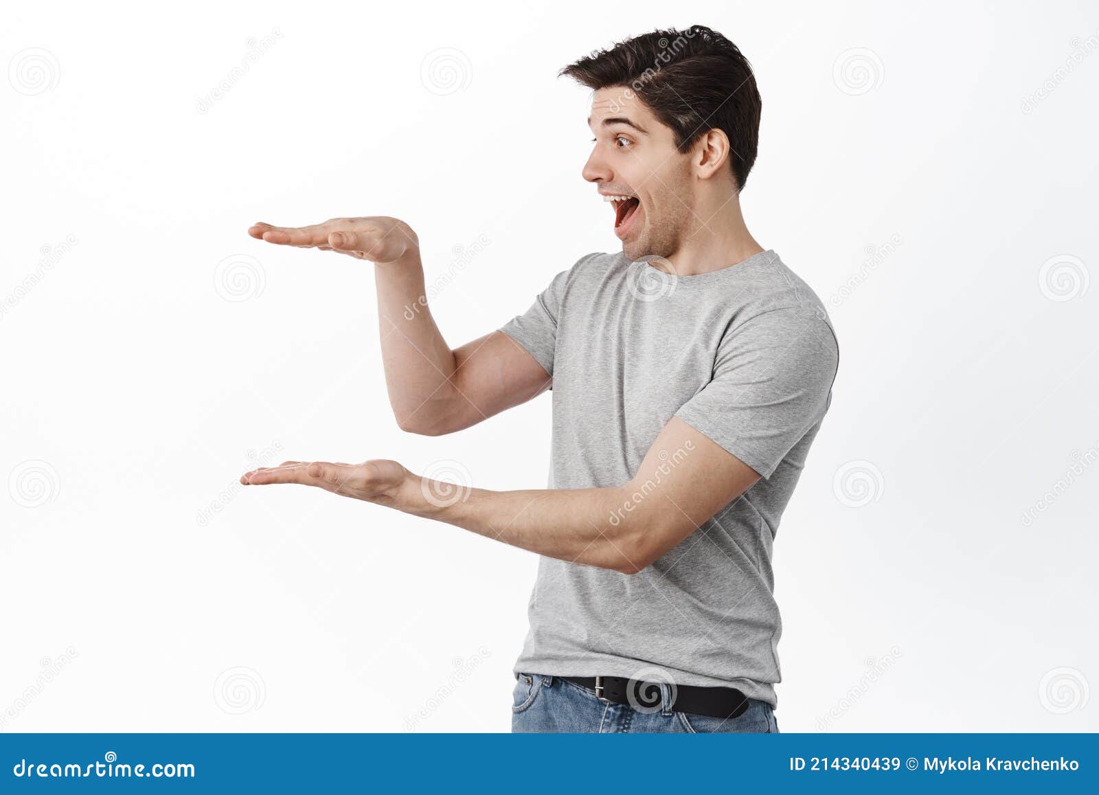 Excited and Happy Young Man Looking at His Hands Holding Empty Copy ...