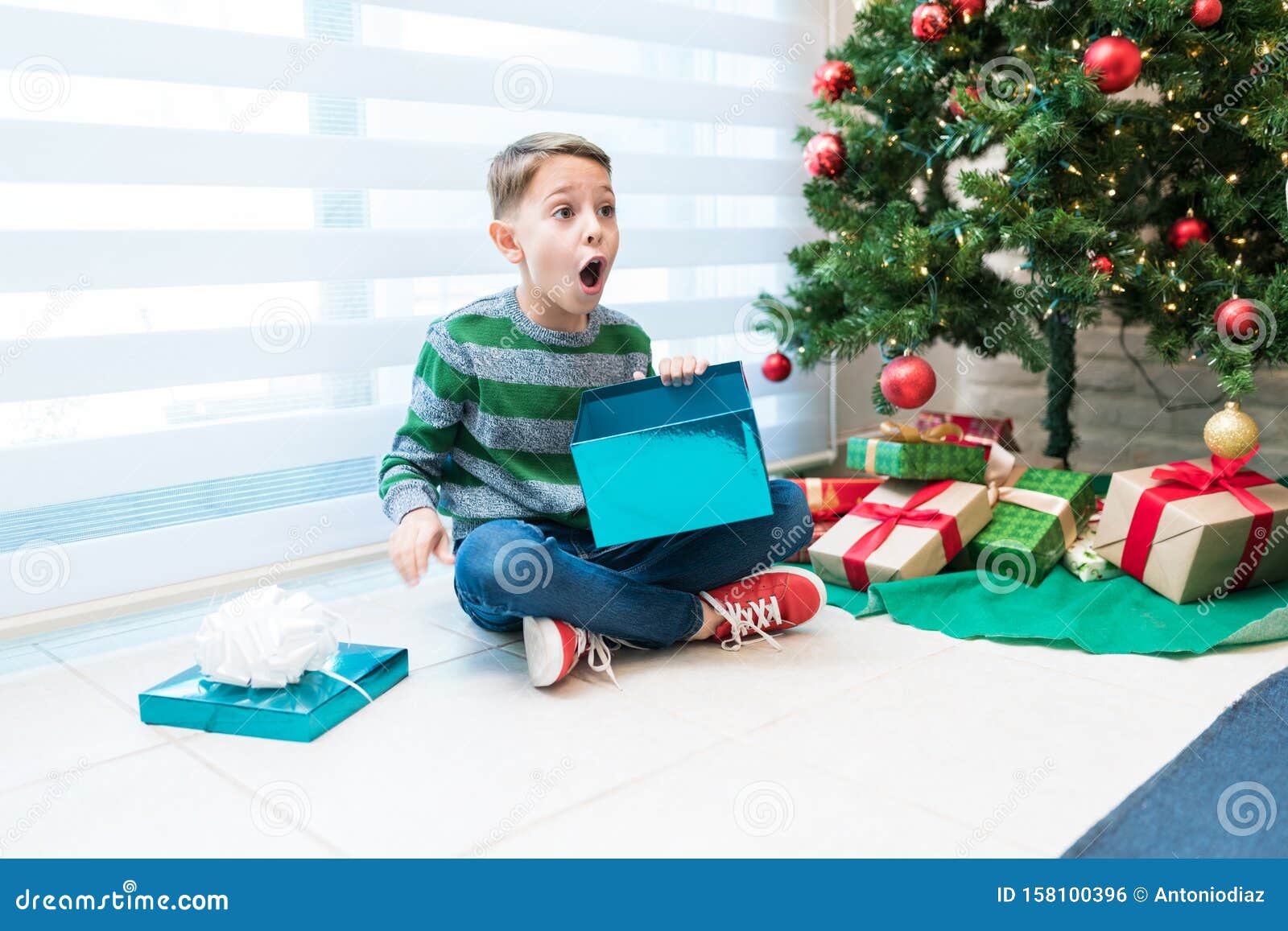 Excited Kid with Christmas Present at Home Stock Photo - Image of ...