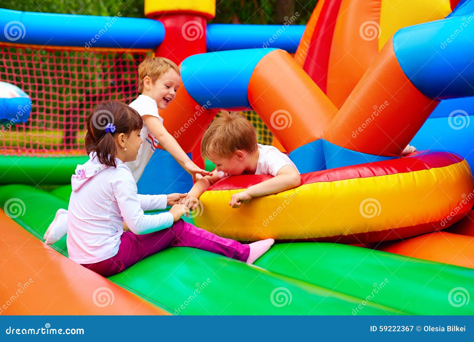 Excited Kids Having Fun on Inflatable Attraction Playground Stock Image ...