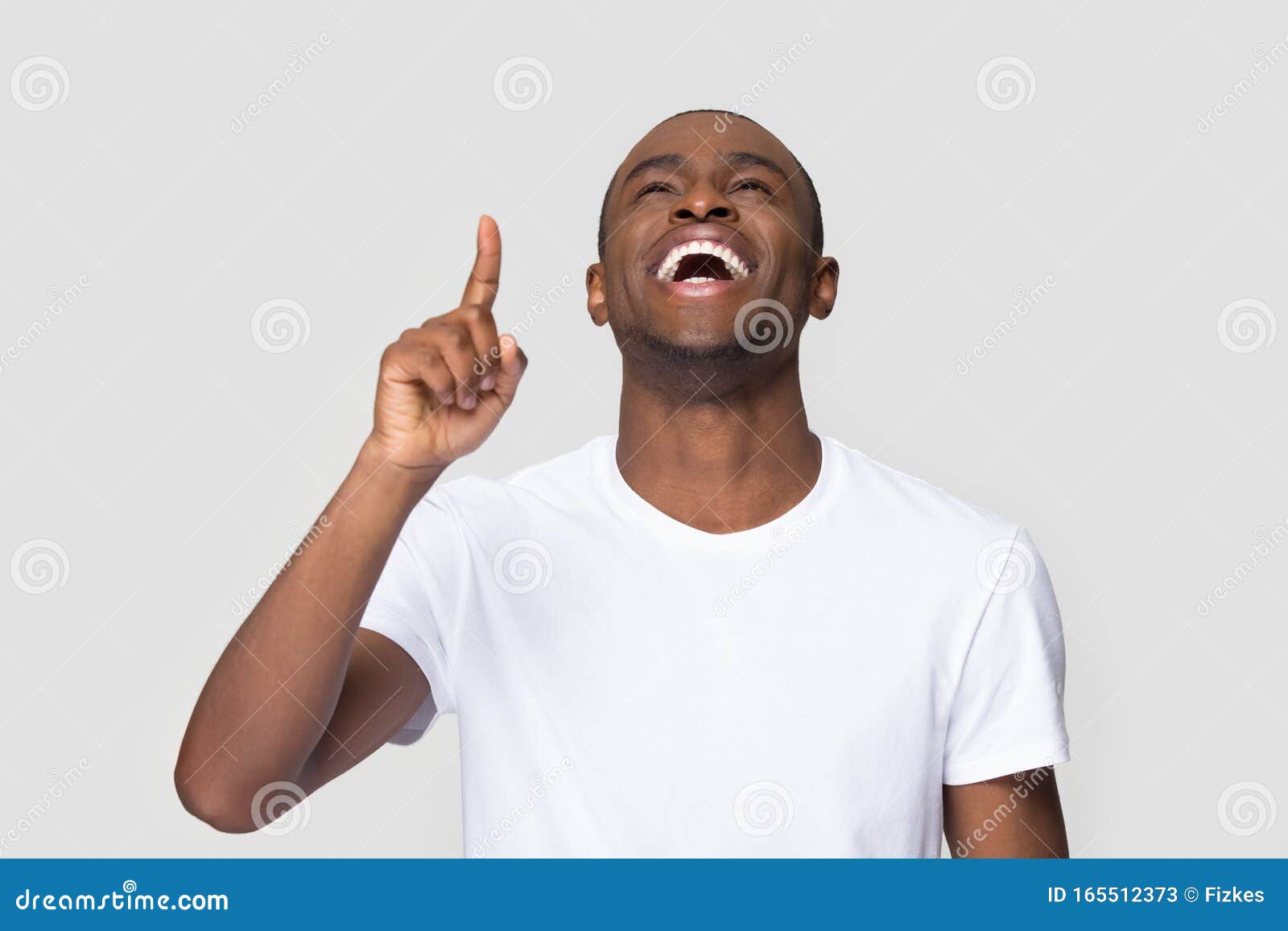 Excited Laughing African American Man Pointing Finger Up Stock Image