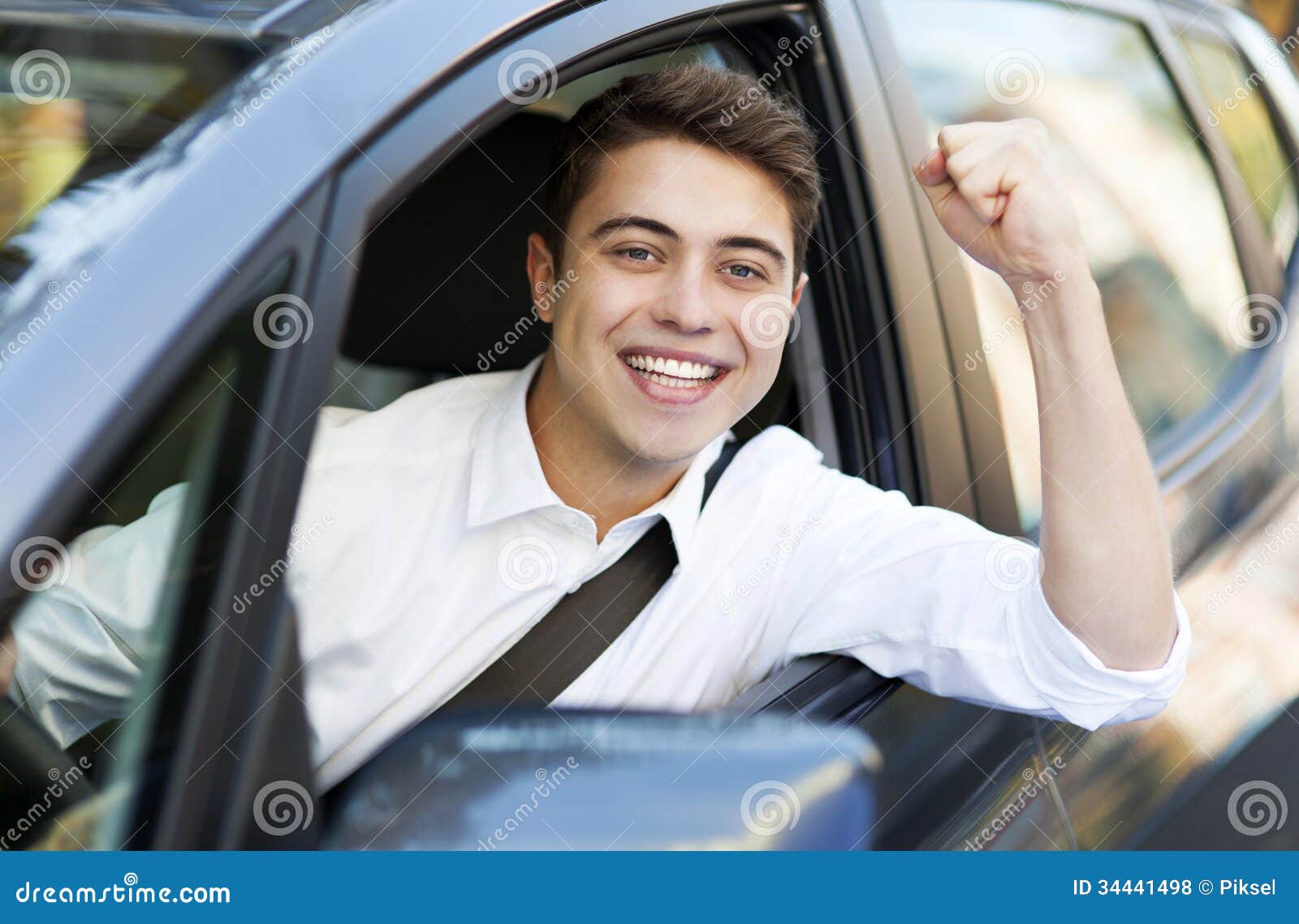 Excited man driving a car stock photo. Image of smile - 34441498