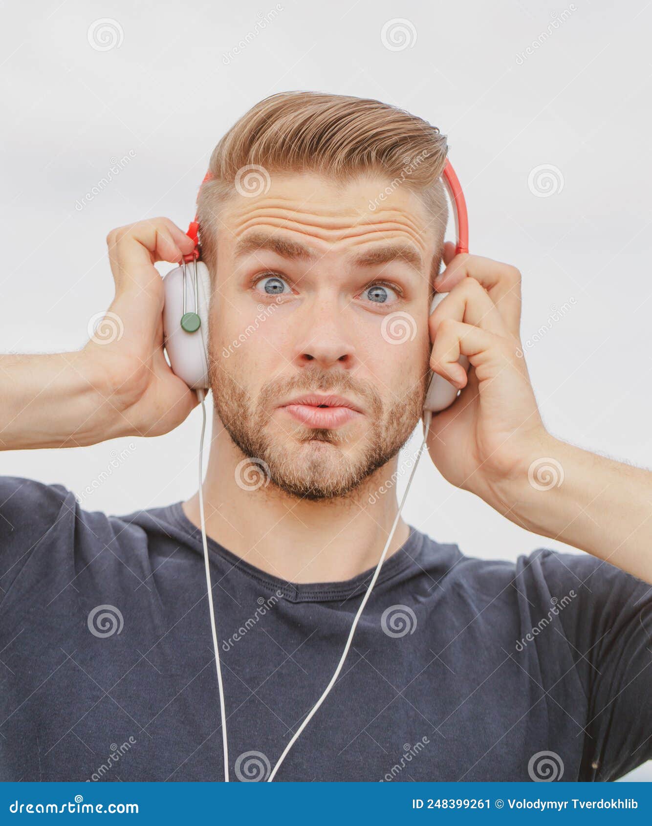 Excited Man Listening Music In Headphones Emotional Surprised Portrait