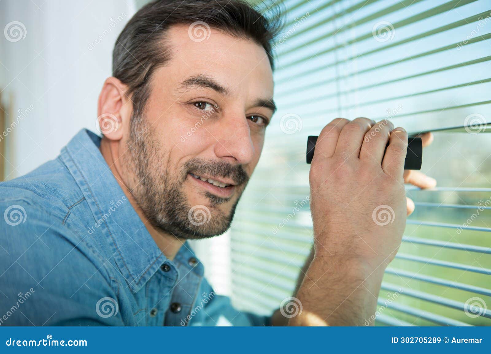 Excited Man Spying through Window Blinds with Binoculars Stock Image ...