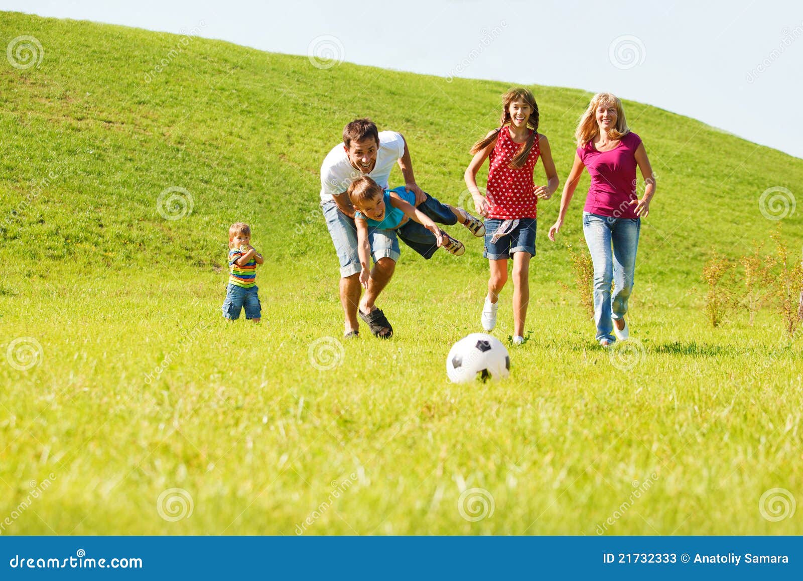 Excited parents with kids stock image. Image of field - 21732333
