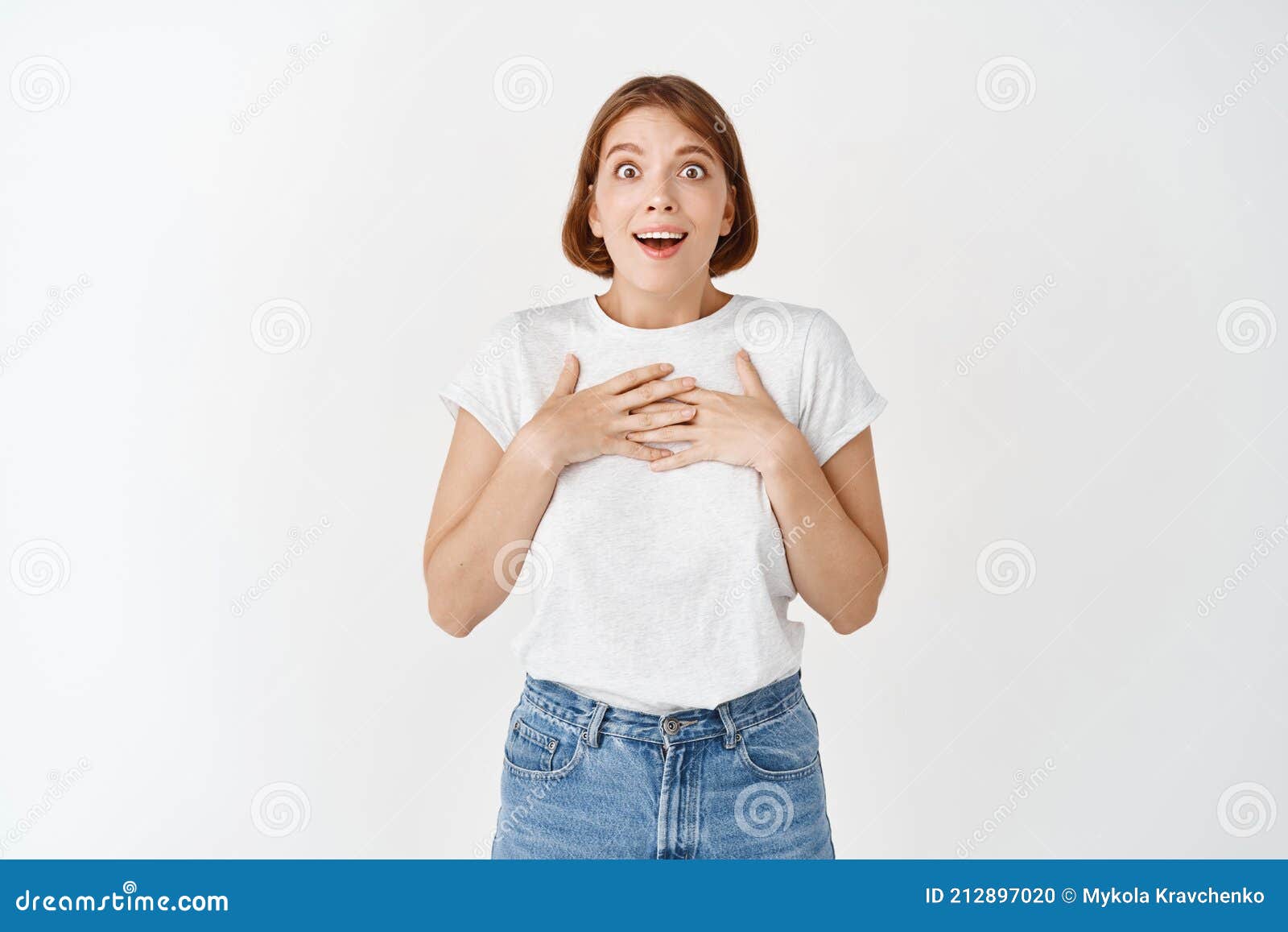 Excited Pretty Woman Gasping Amazed Holding Hands On Chest Look