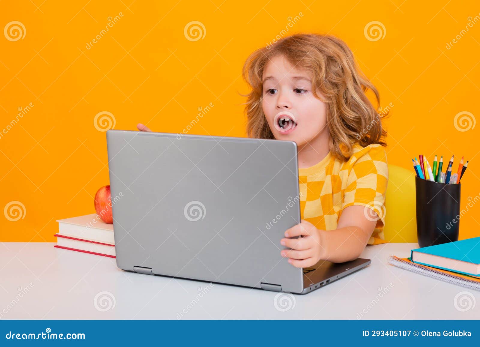 Excited School Child Using Laptop Computer. Child from Elementary ...