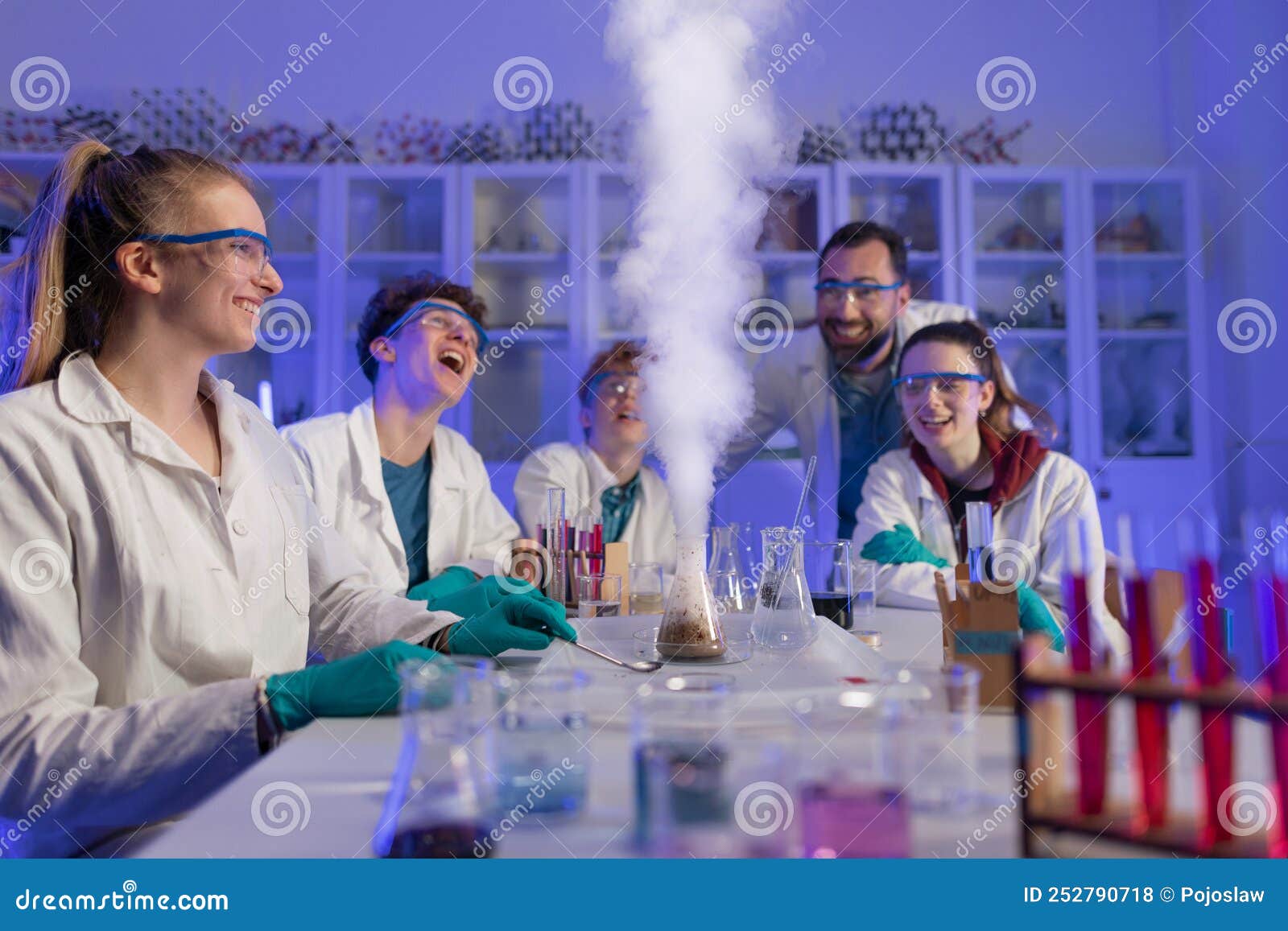 Excited Science Students with Teacher Doing Chemical Experiment in the ...