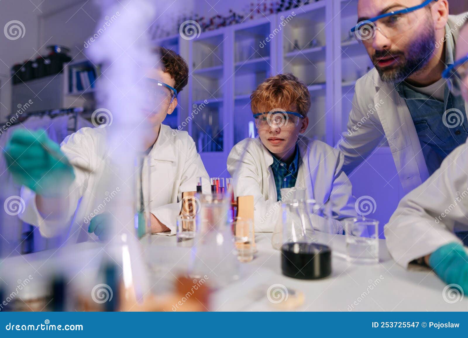Excited Science Students with Teacher Doing Chemical Experiment in the ...