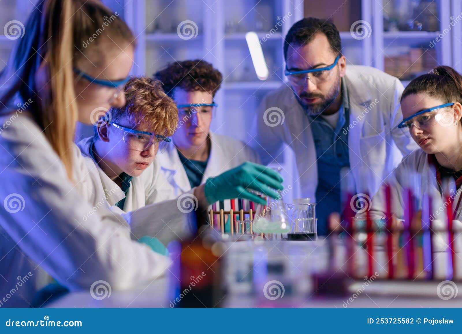 Excited Science Students with Teacher Doing Chemical Experiment in the ...