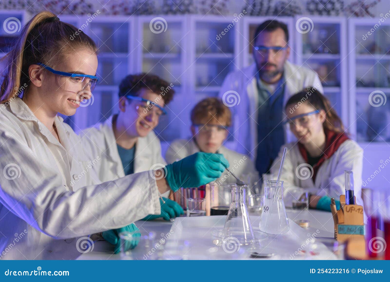 Excited Science Students with Teacher Doing Chemical Experiment in the ...