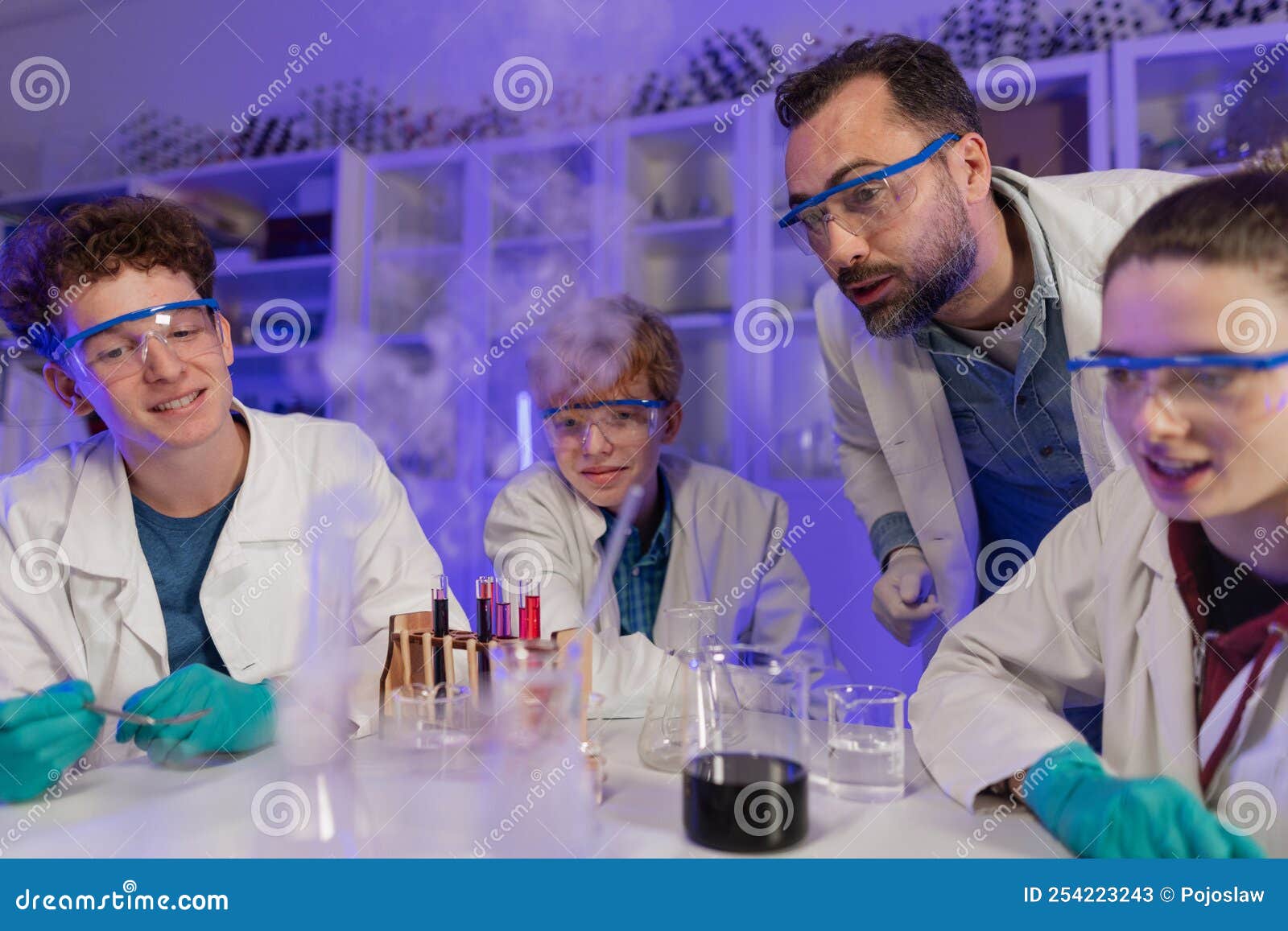 Excited Science Students with Teacher Doing Chemical Experiment in the ...