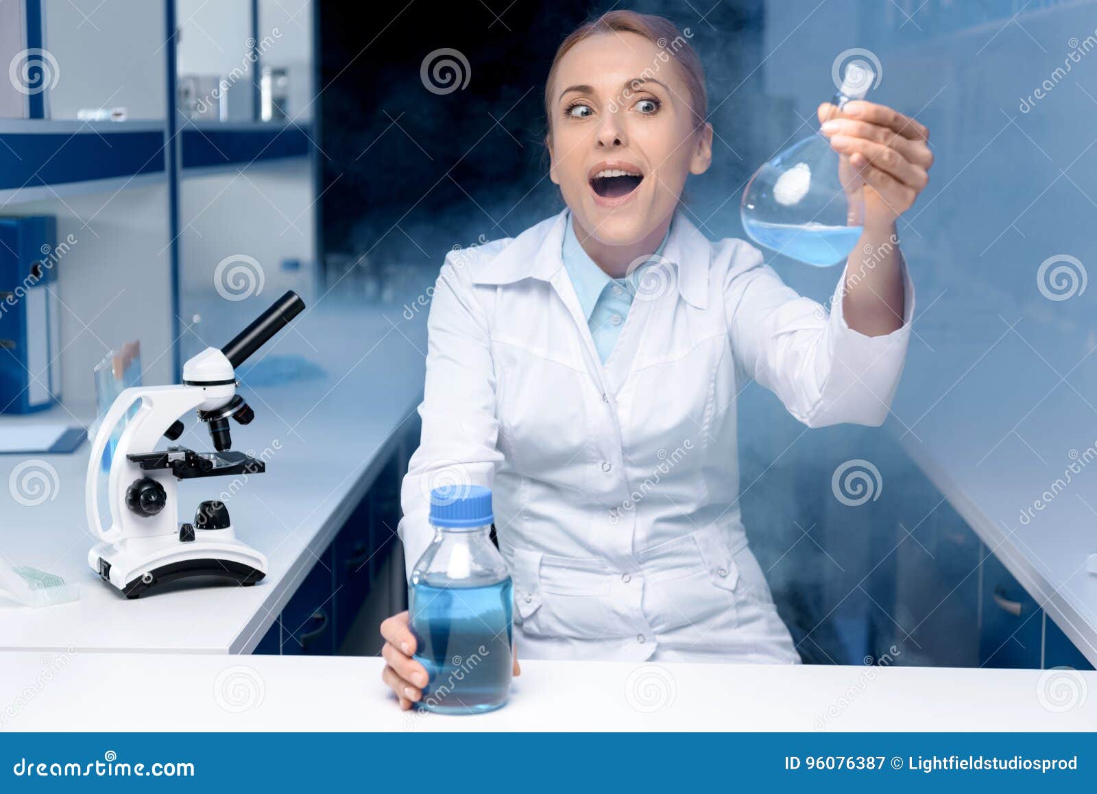 Excited Scientist Working with Reagent in Flask in Laboratory Stock ...