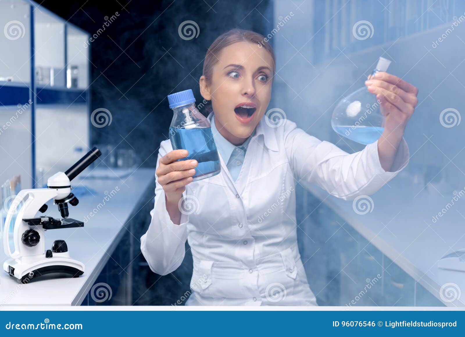 Excited Scientist Working with Reagent in Flask in Laboratory Stock ...