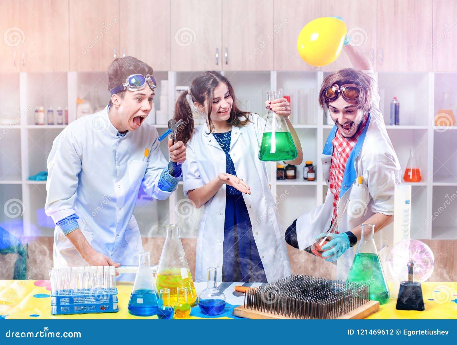 Excited scientists in lab stock photo. Image of equipment - 121469612