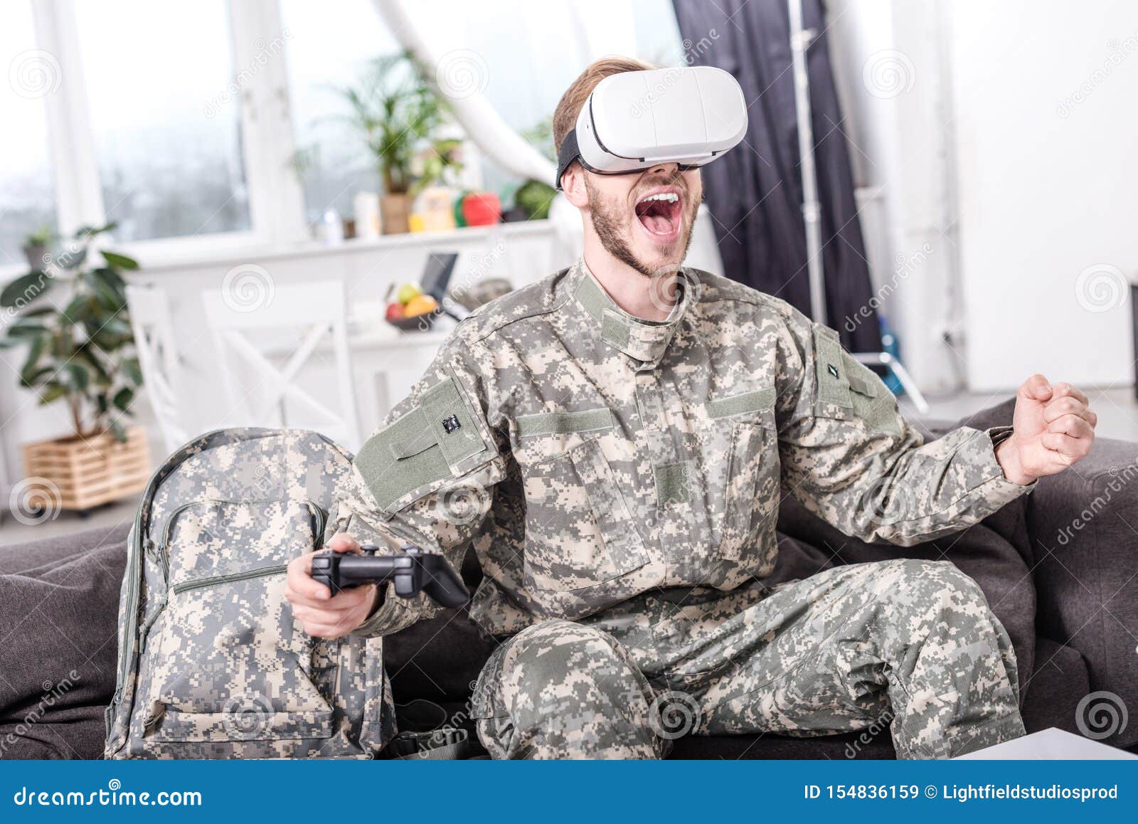 Excited Soldier in Virtual Reality Headset Playing Video Game Stock ...