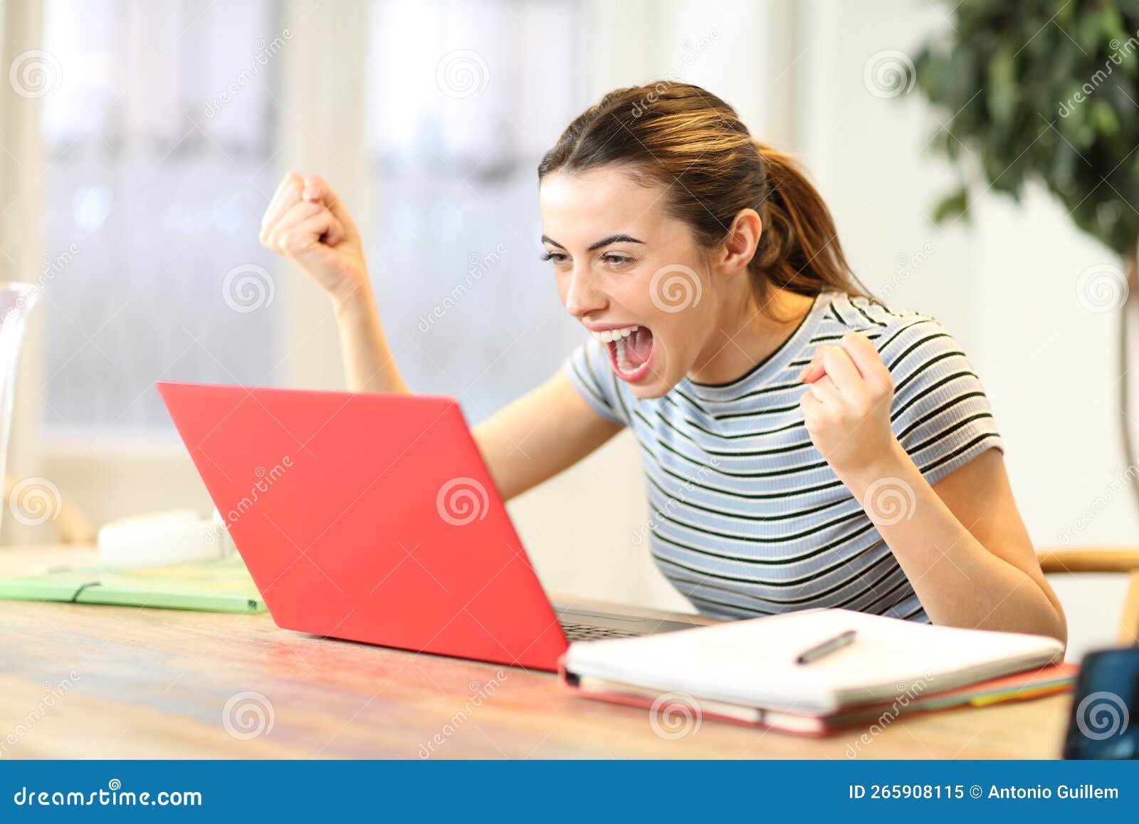 Excited Student Checking Laptop Content Stock Image - Image of approved ...