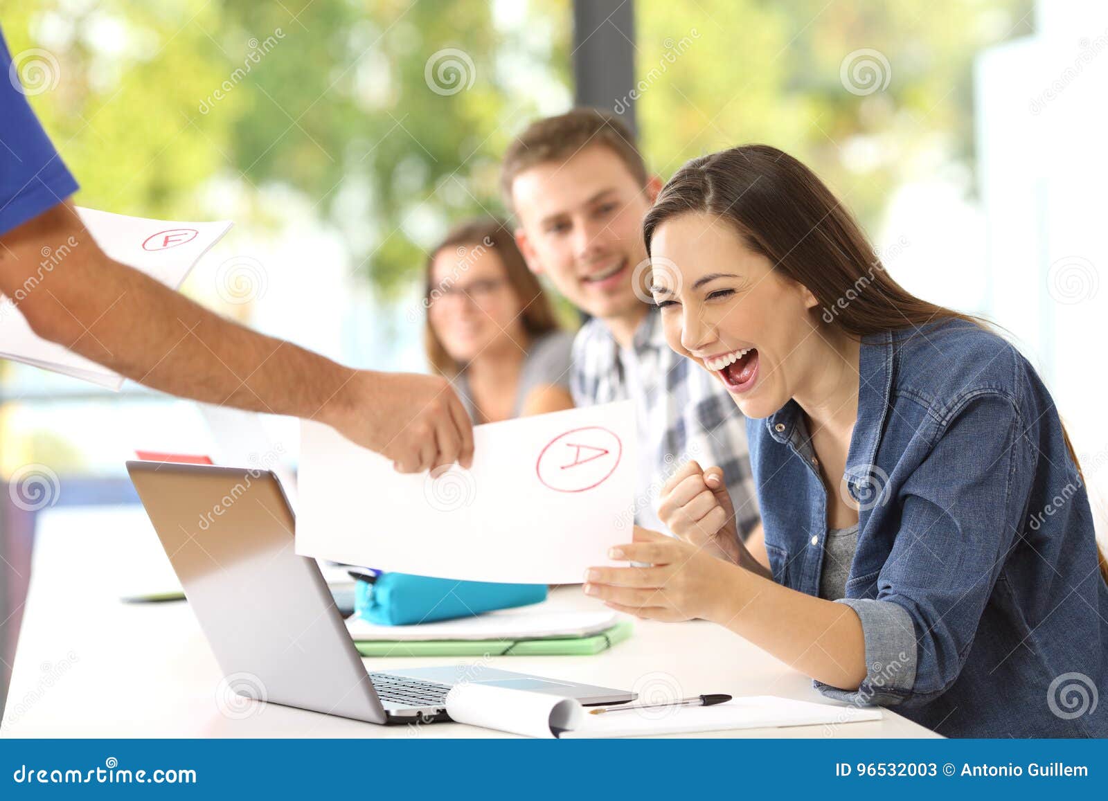 Excited Student Receiving an Approved Exam Stock Image - Image of ...