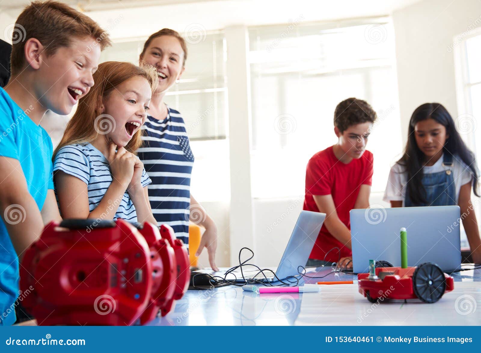 Excited Students Watching Robot Vehicle Move after Coding Lesson in ...