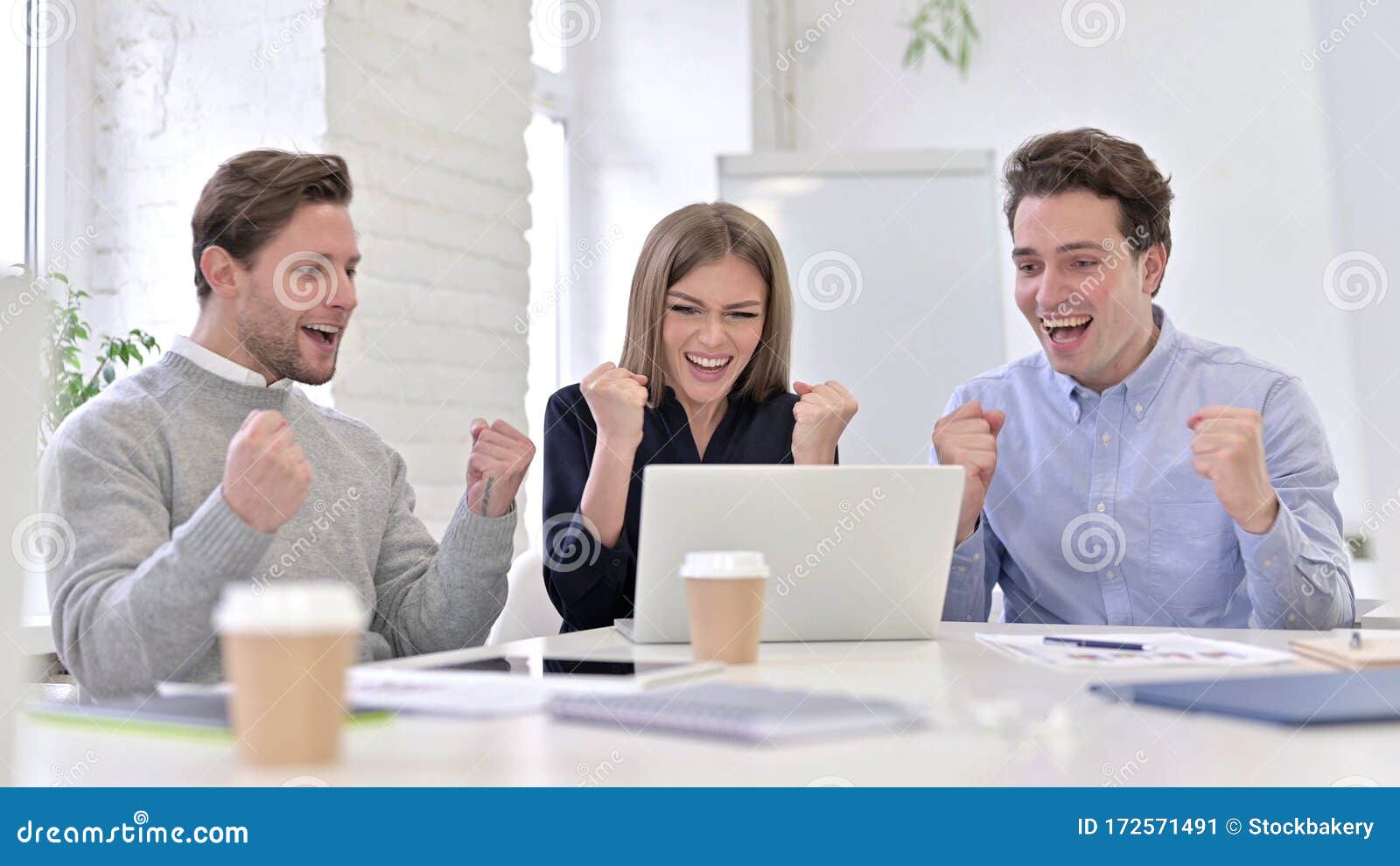 The Excited Team Celebrating Success in Modern Office Stock Image ...